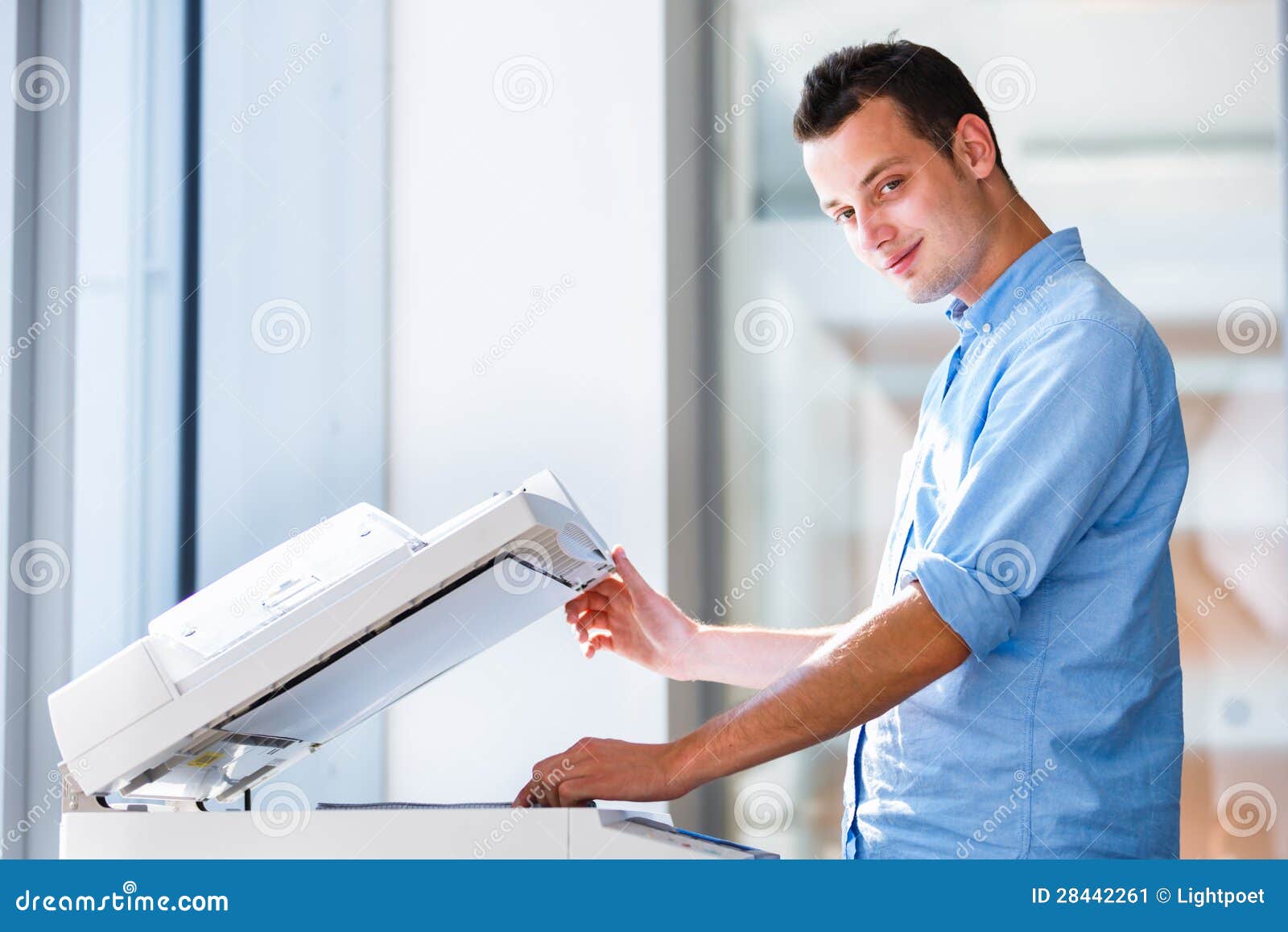 Handsome Young Man Using a Copy Machine Stock Image - Image of ...