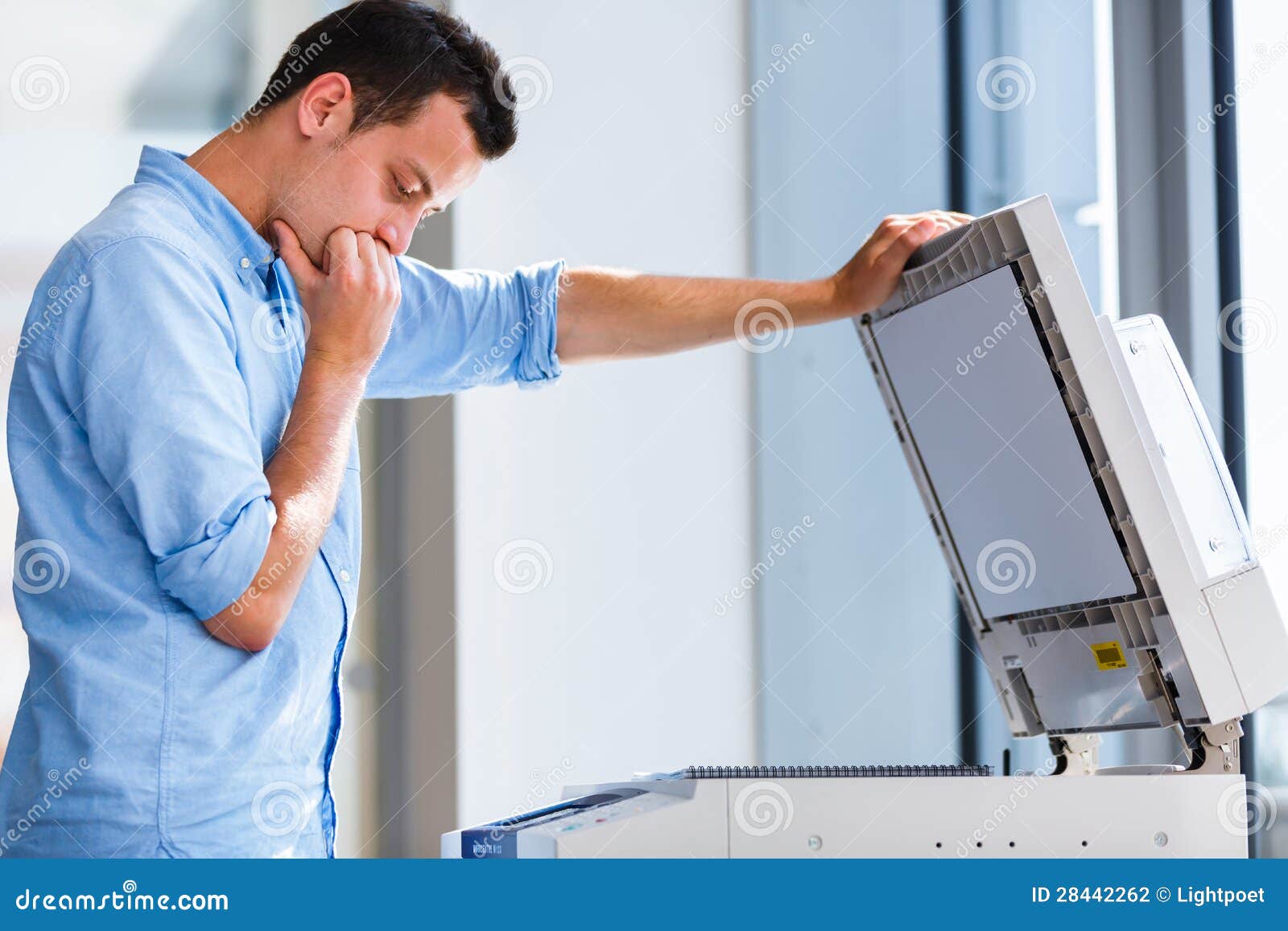 Handsome Young Man Using a Copy Machine Stock Photo - Image of ...