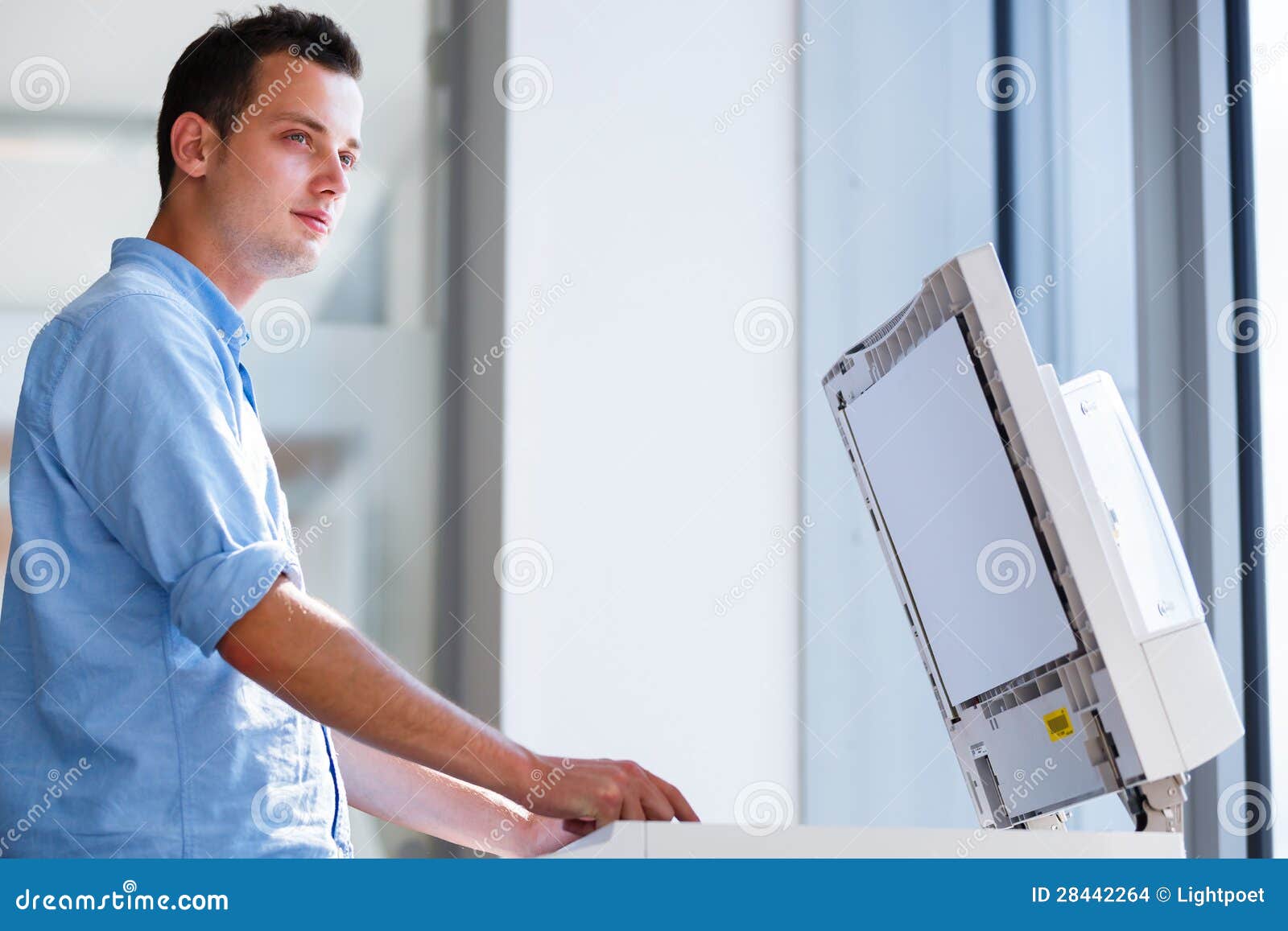 Handsome Young Man Using a Copy Machine Stock Photo - Image of adult ...
