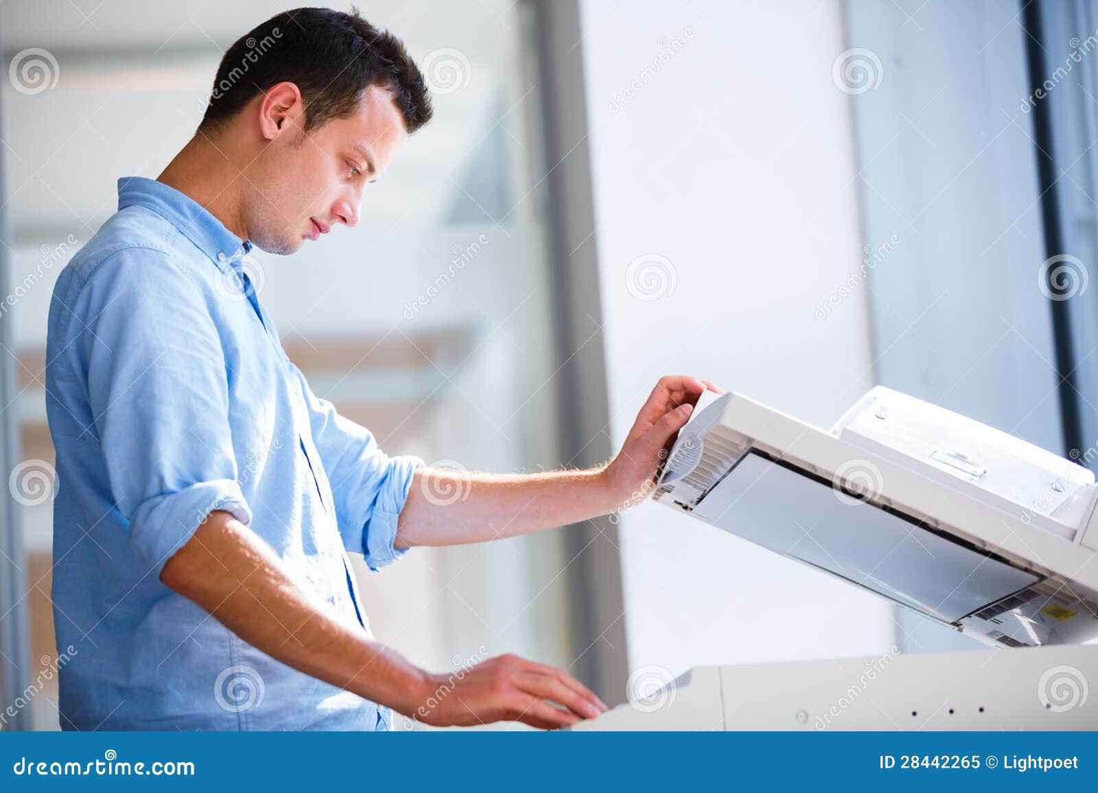 Handsome Young Man Using A Copy Machine Royalty Free Stock Photo ...