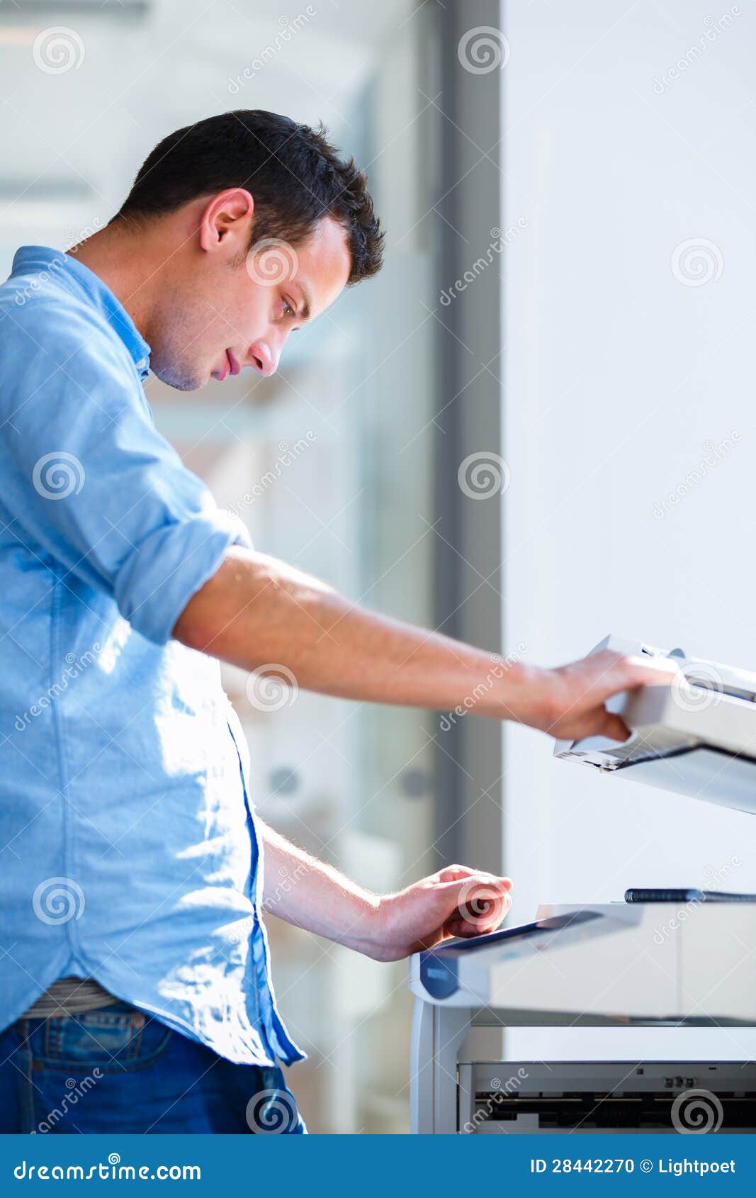 Handsome Young Man Using a Copy Machine Stock Photo - Image of ...
