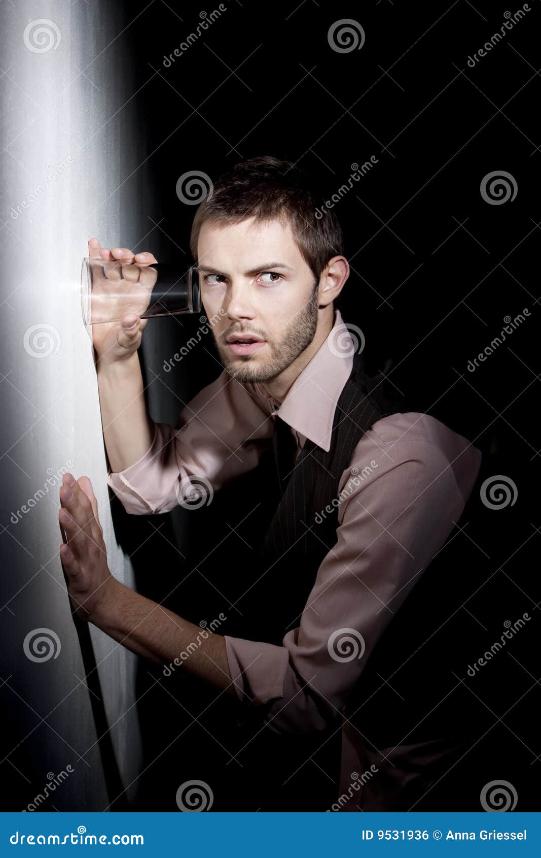 Handsome Young Man Using Glass To Eavesdrop Stock Photo - Image of dark ...