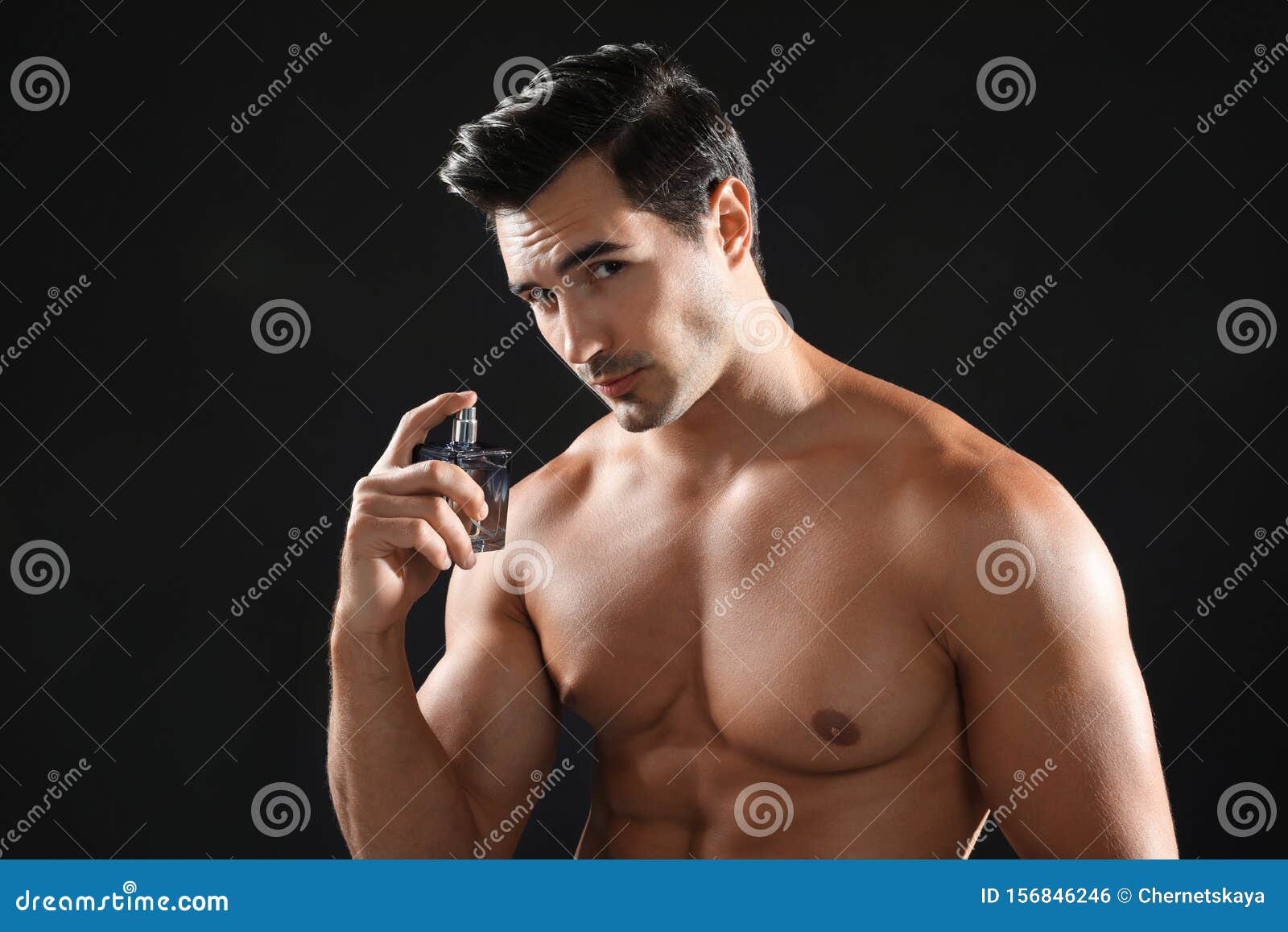 Handsome Young Man Using Perfume Stock Photo - Image of essential ...