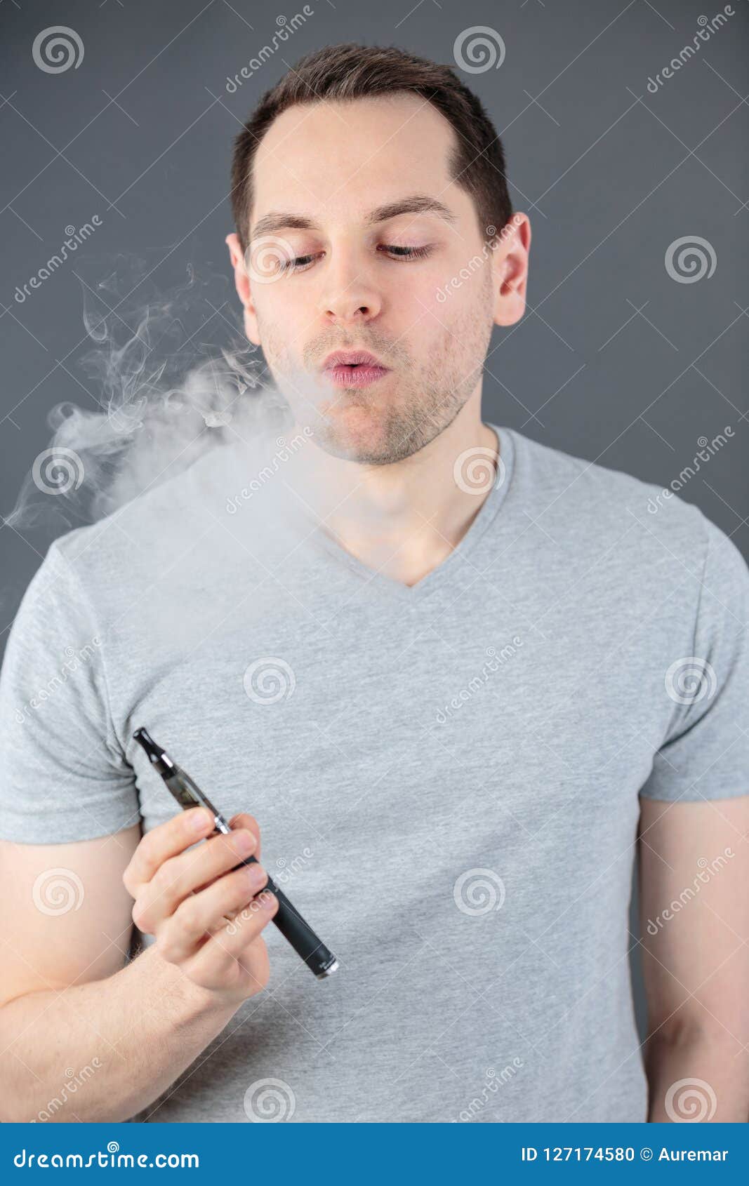 Handsome young man vaping stock photo. Image of ecig - 127174580