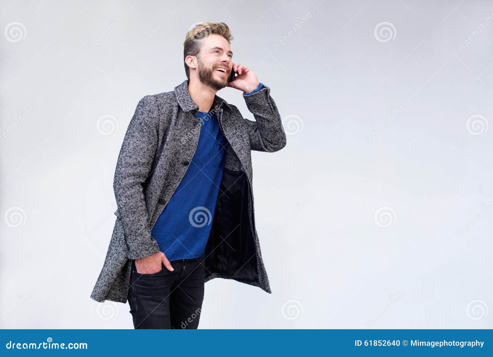 Handsome Young Man Walking Ad Talking on Mobile Phone Stock Photo ...
