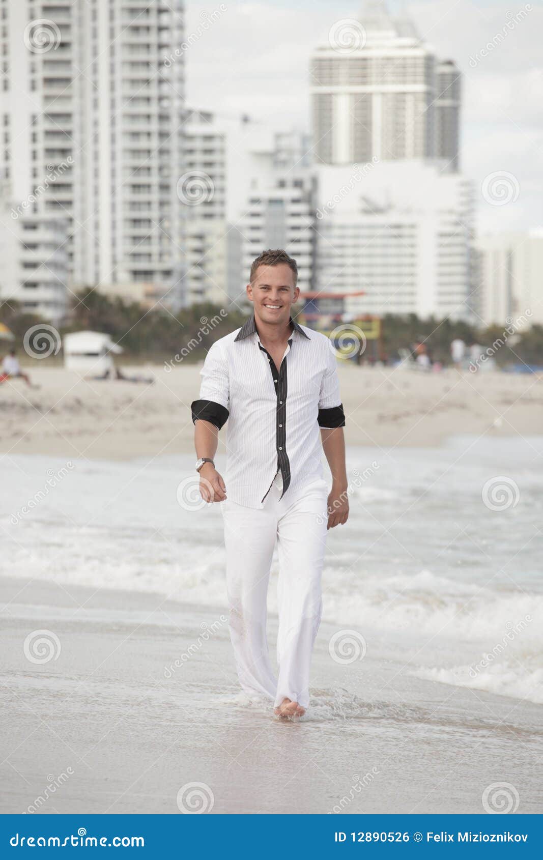 Handsome Young Man Walking on the Beach Stock Photo - Image of ...