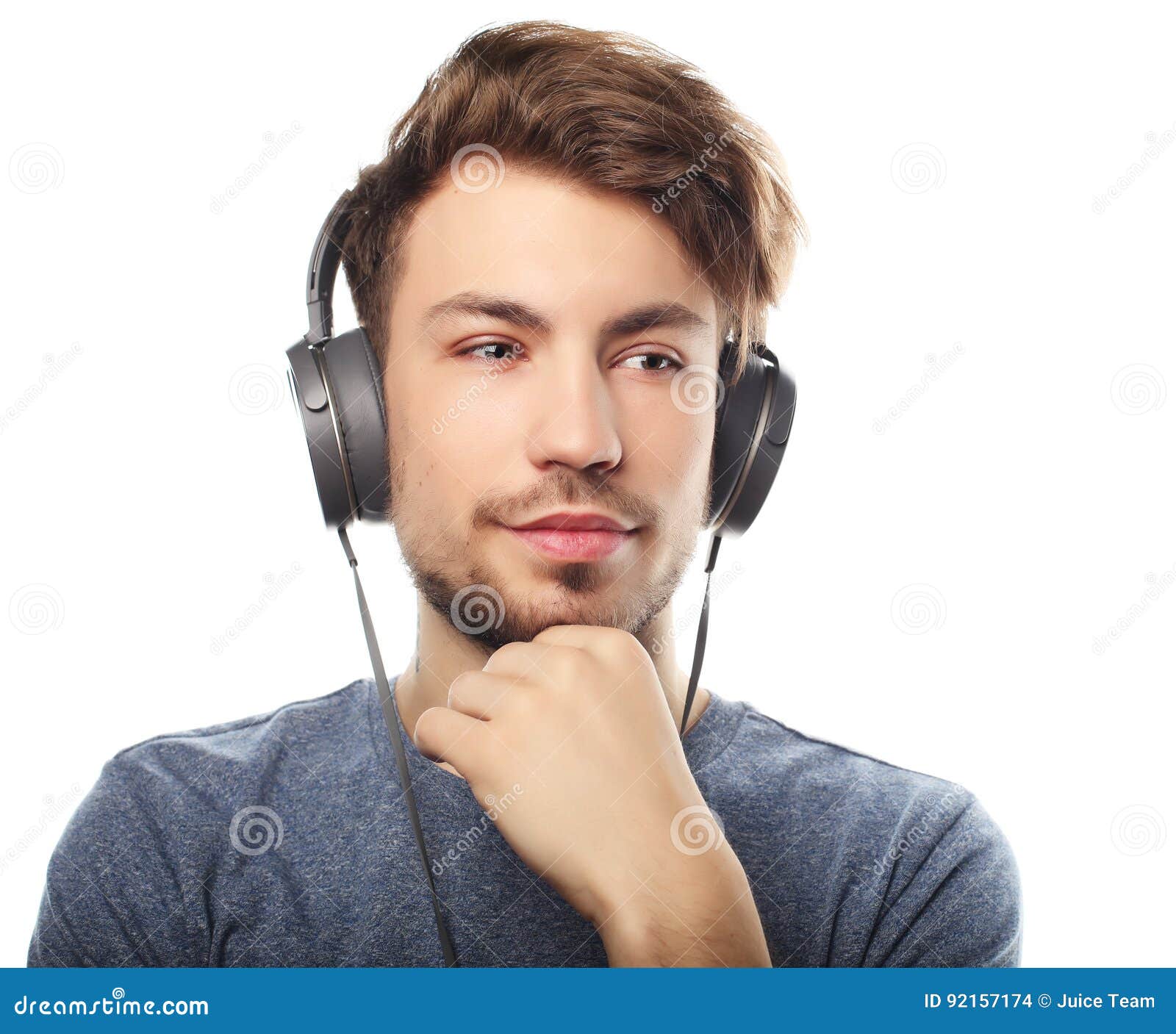 Handsome Young Man Wearing Headphones And Listening To Music Stock