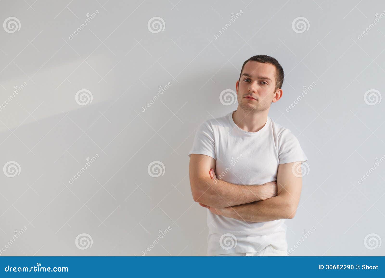 Handsome Young Man at White Wall Stock Photo - Image of confident ...