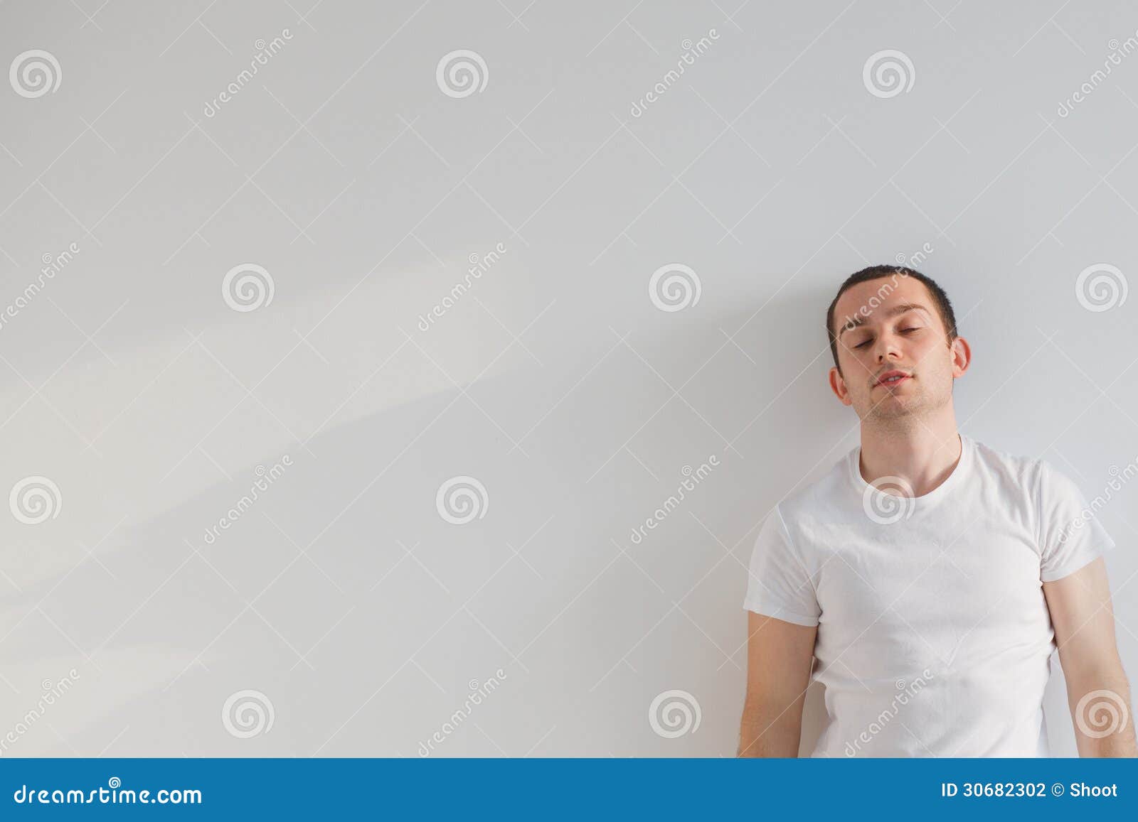 Handsome Young Man at White Wall Stock Photo - Image of copyspace ...