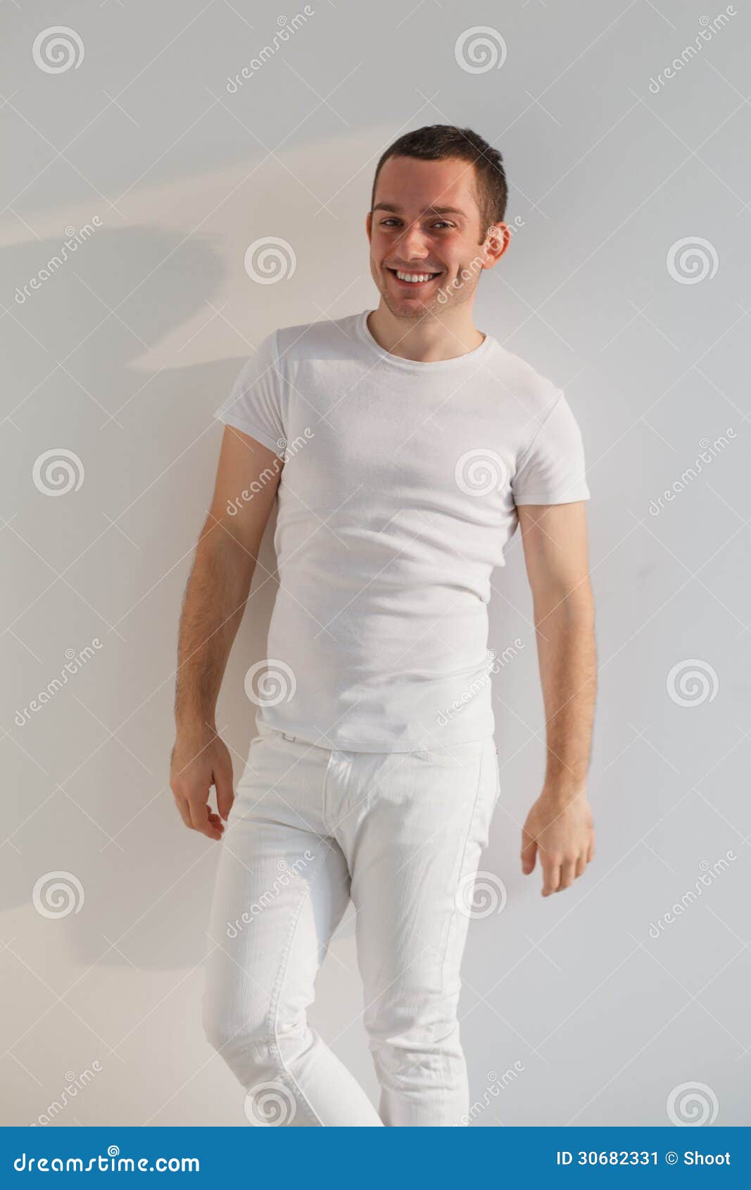 Handsome Young Man at White Wall Stock Image - Image of comfortable ...
