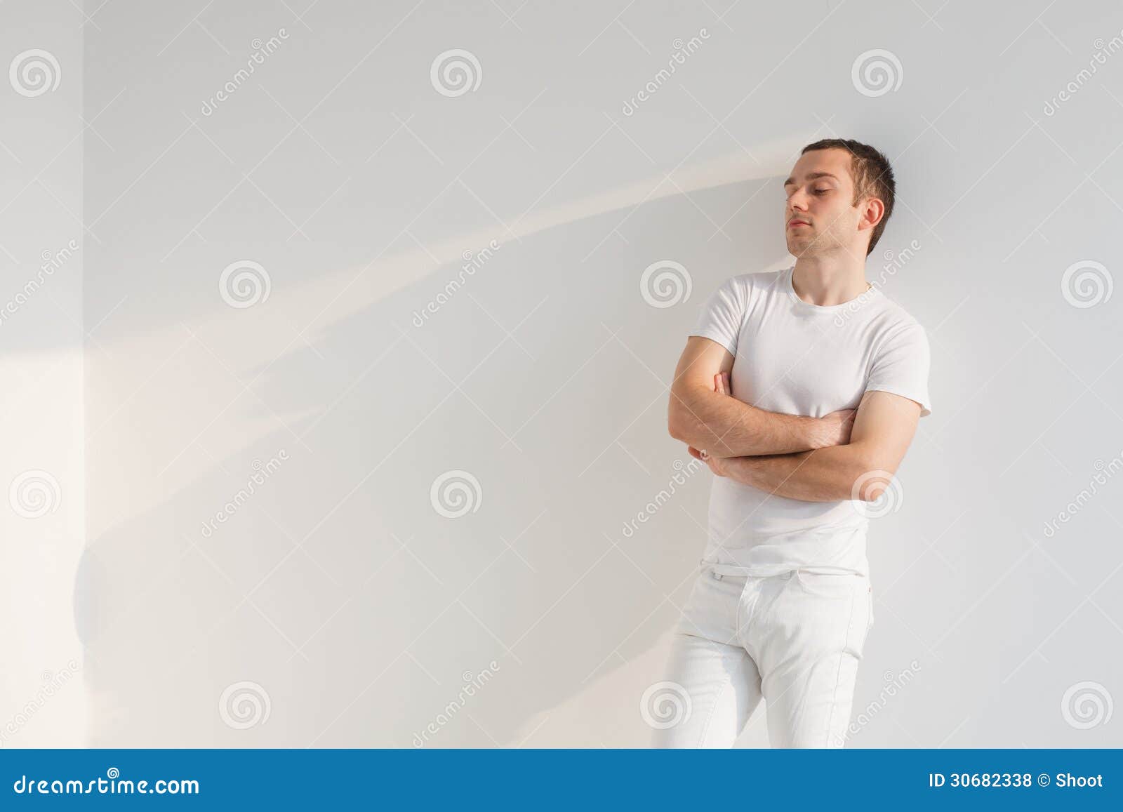 Handsome Young Man at White Wall Stock Photo - Image of adult, joyful ...
