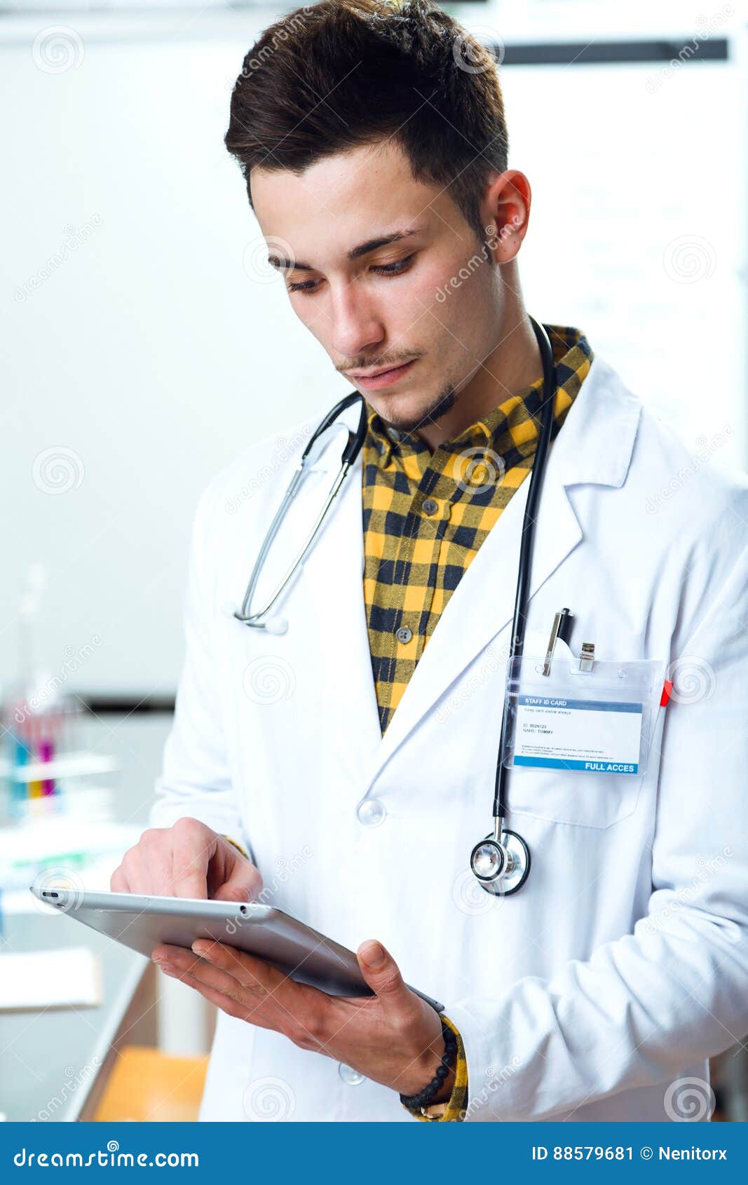 Handsome Young Man Working with Digital Tablet in Laboratory. Stock ...