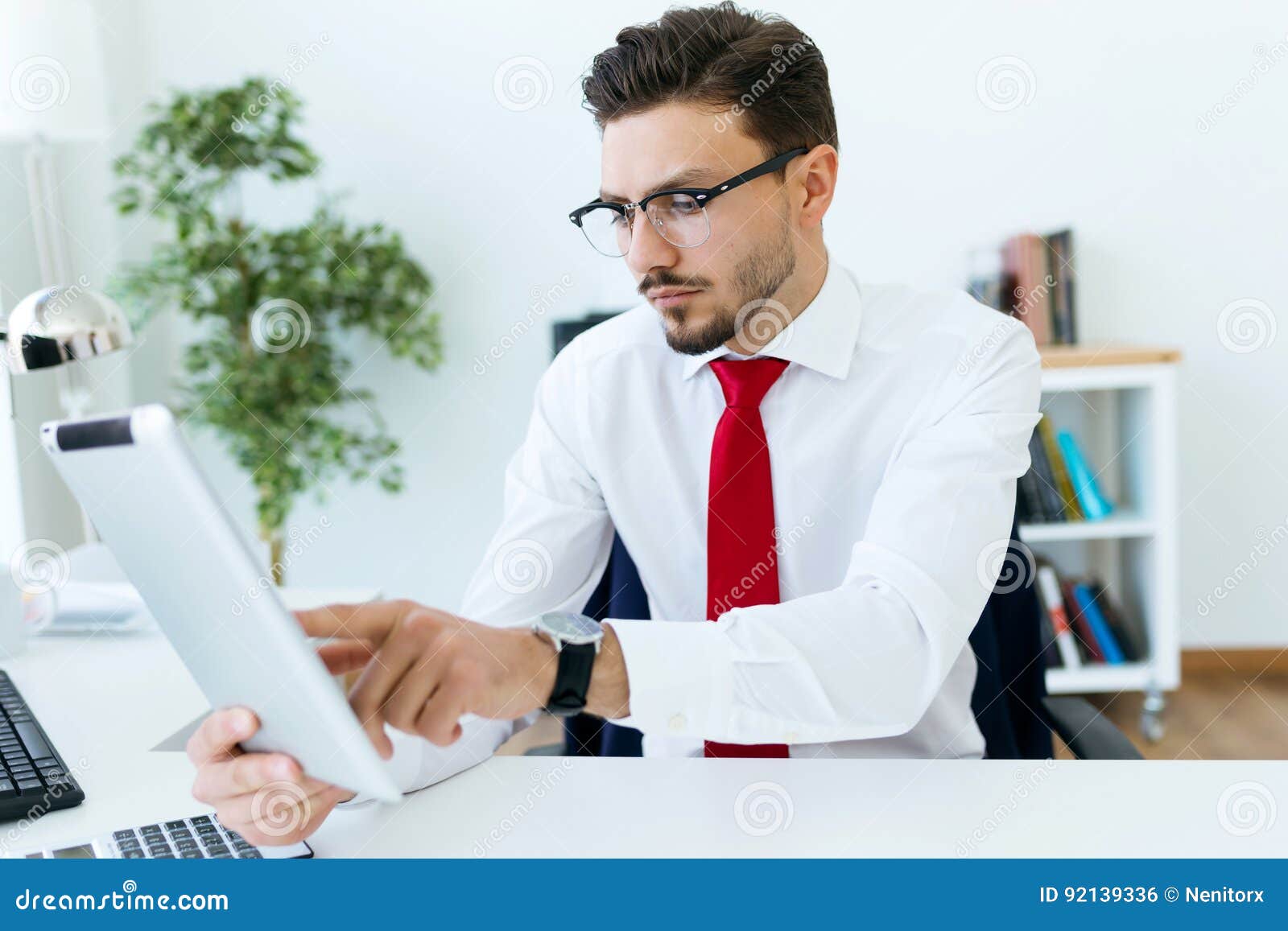 Handsome Young Man Working with Digital Tablet in the Office. Stock ...