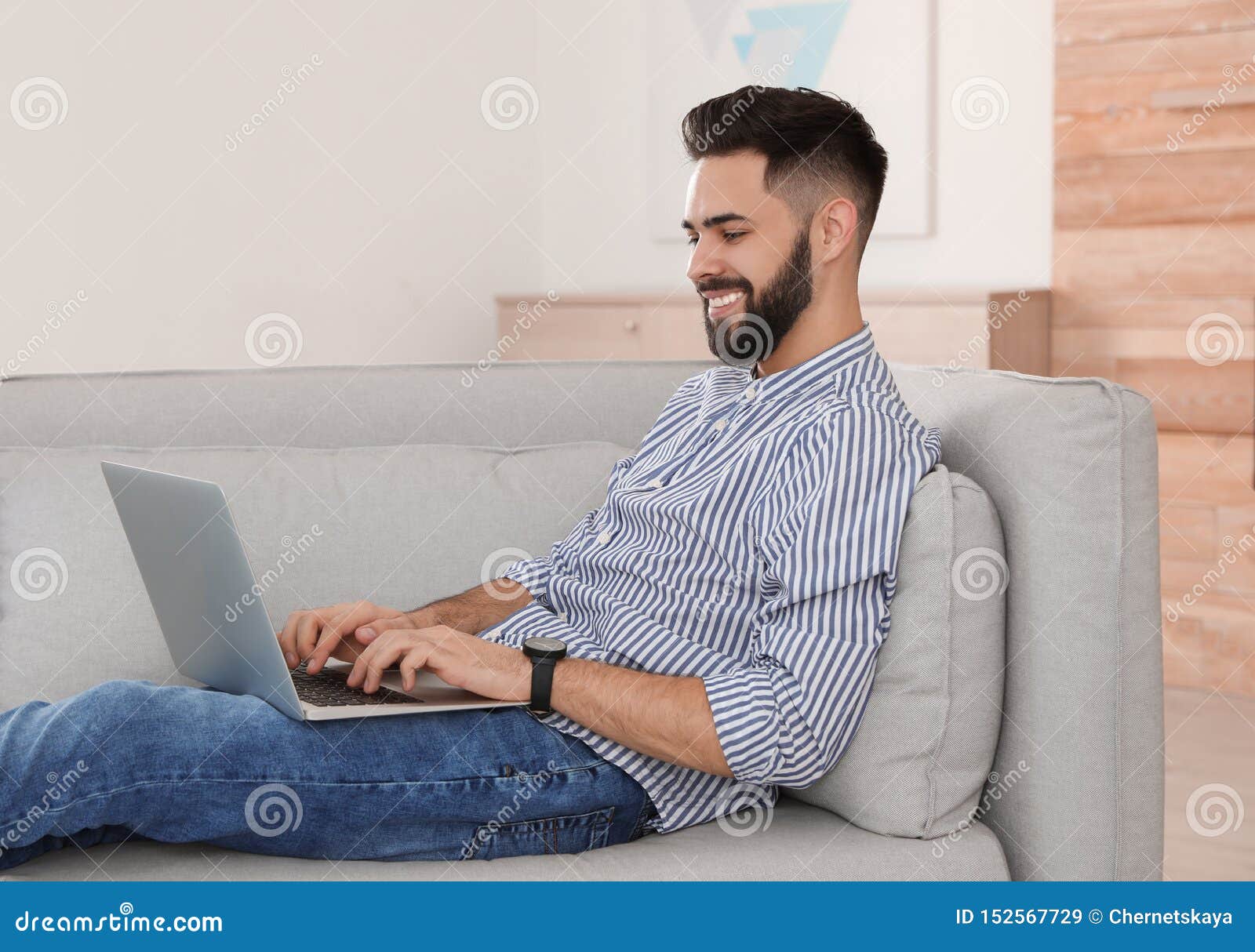Handsome Young Man Working with Laptop on Sofa Stock Image - Image of ... Handsome Young Man Working with Laptop on Sofa Stock Image - Image of ...