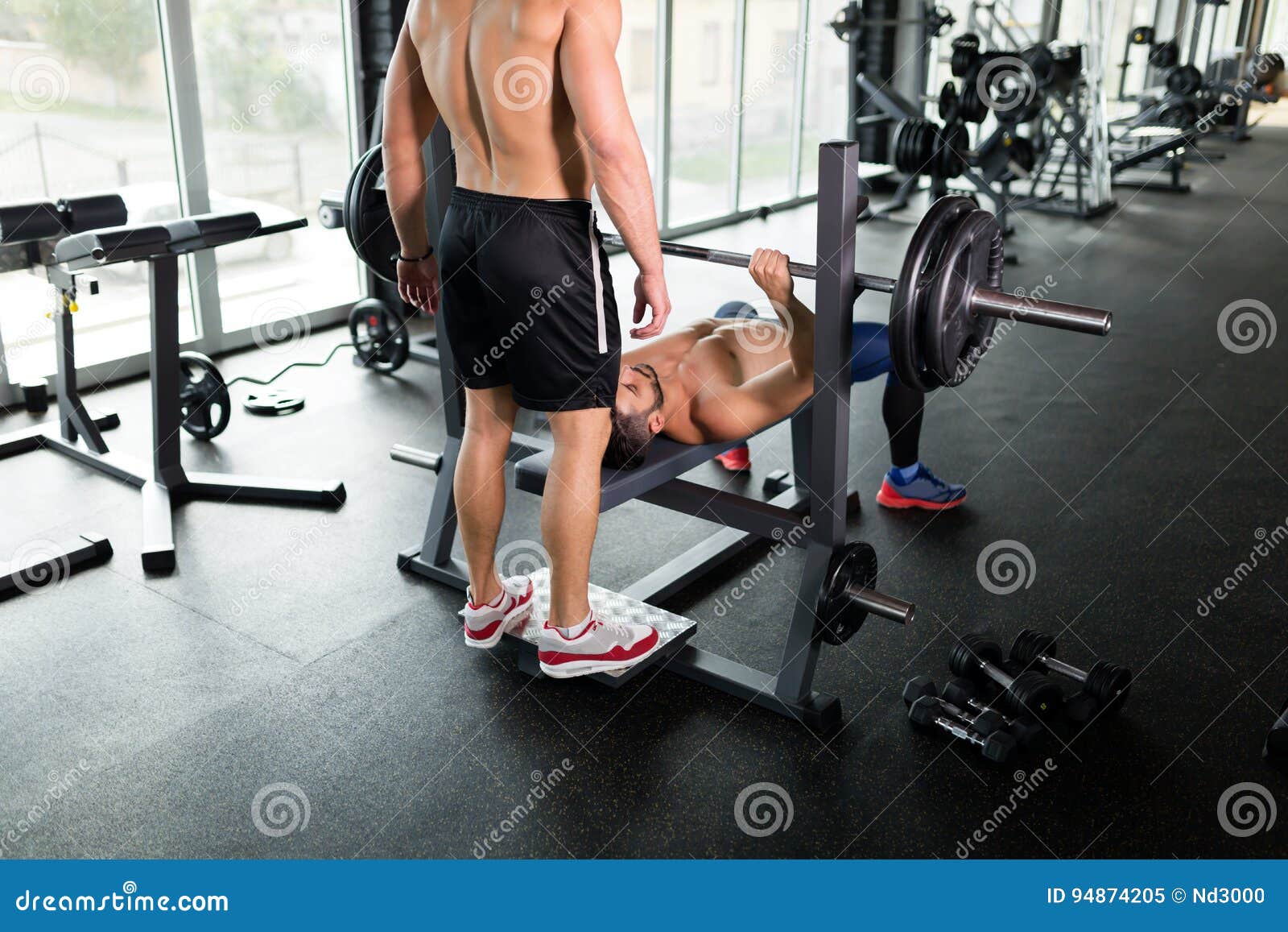 Handsome Young Muscular Man Doing Bench Press and Gets Help Stock Image ...