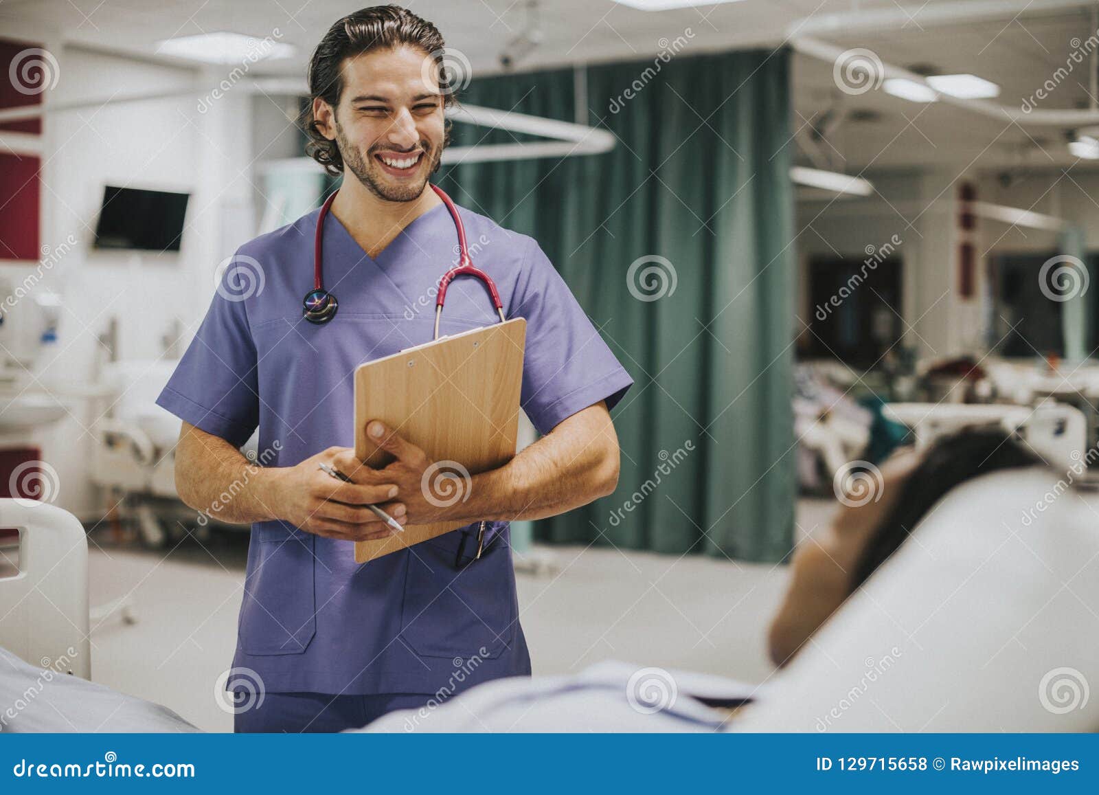 Handsome Young Physician at a Hospital Stock Photo - Image of hospital ...