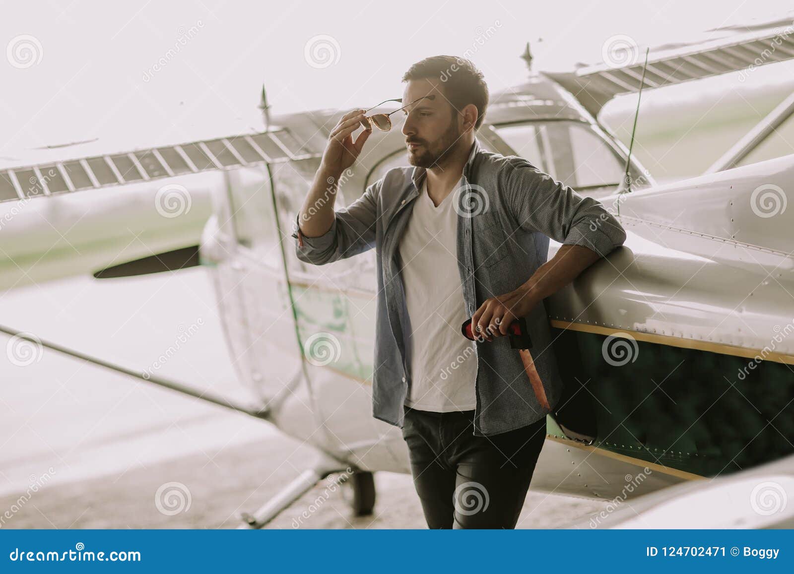 Young Pilot Checking Ultralight Airplane before Flight Stock Image ...