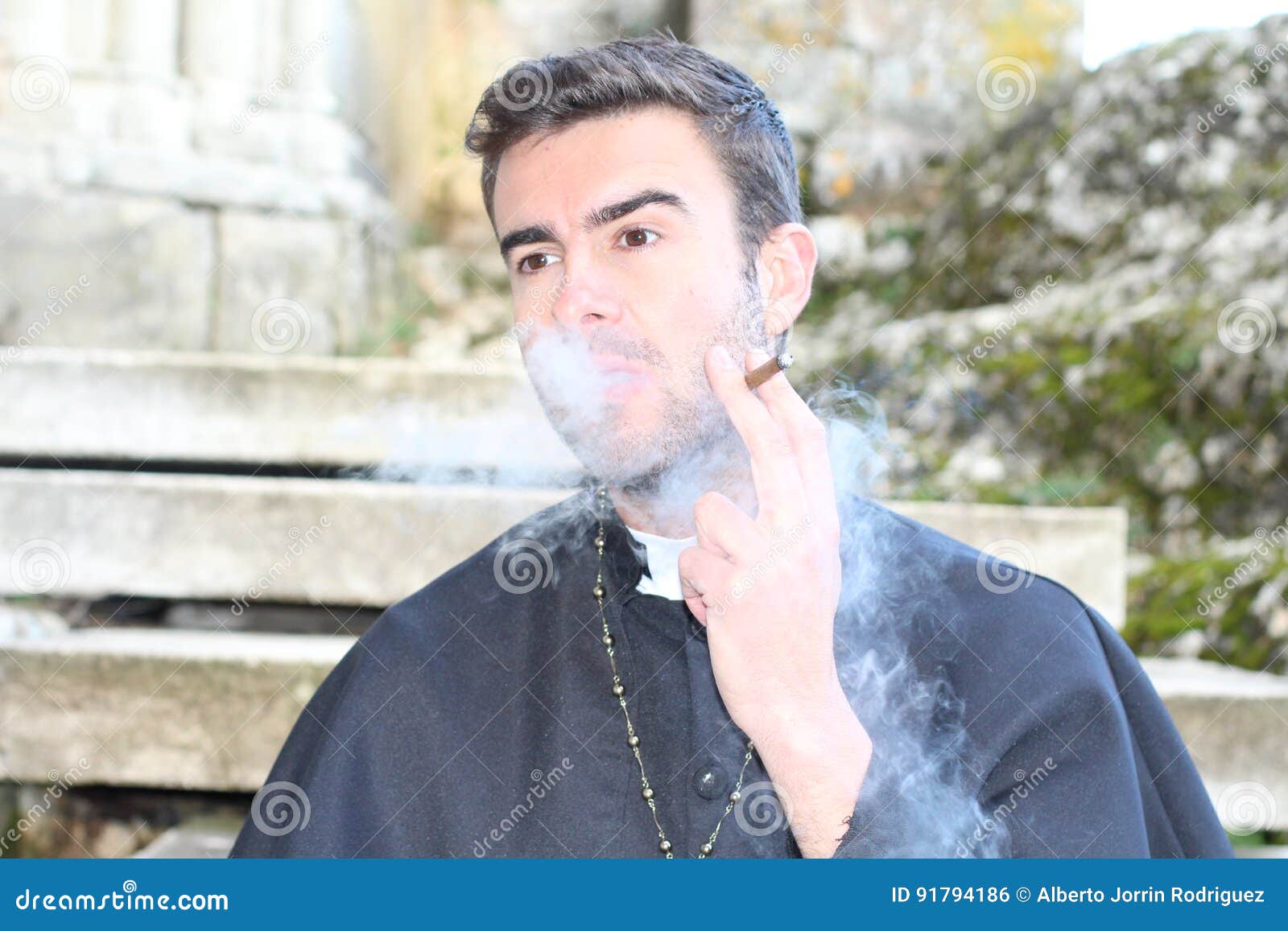 Handsome Young Priest Smoking and Looking Away Stock Photo - Image of ...