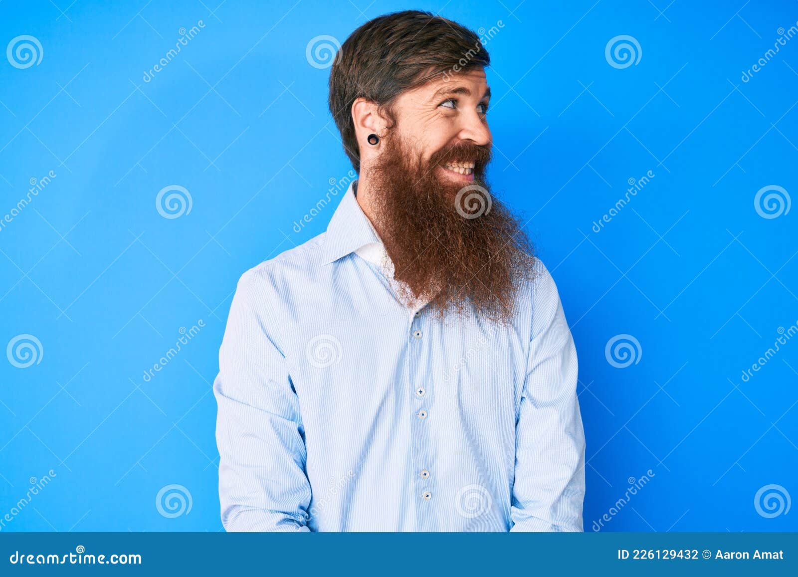 Handsome Young Red Head Man With Long Beard Wearing Elegant Clothes