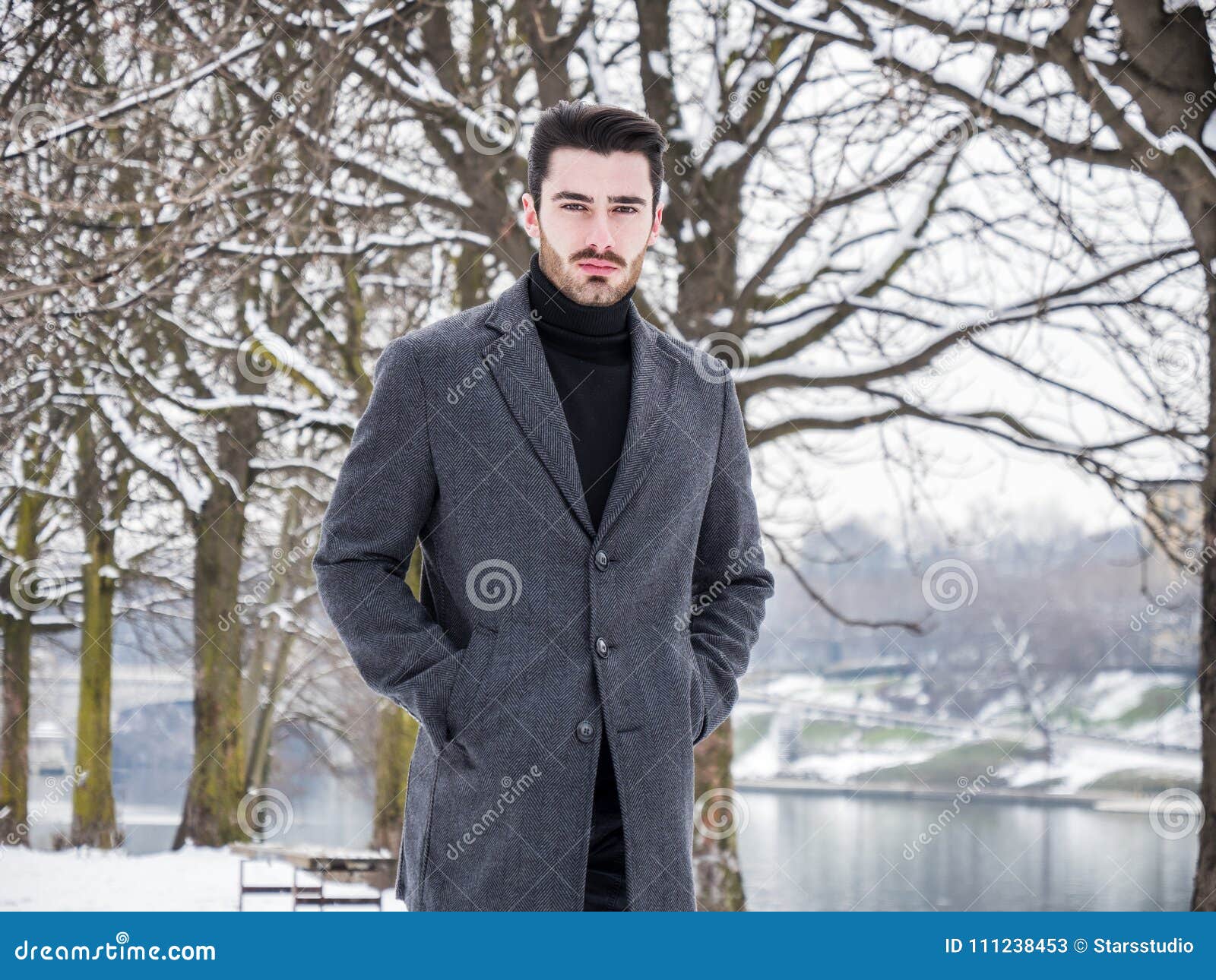 Handsome Young Man in Snowy Park Stock Image - Image of lifestyle ... Handsome Young Man in Snowy Park Stock Image - Image of lifestyle ...