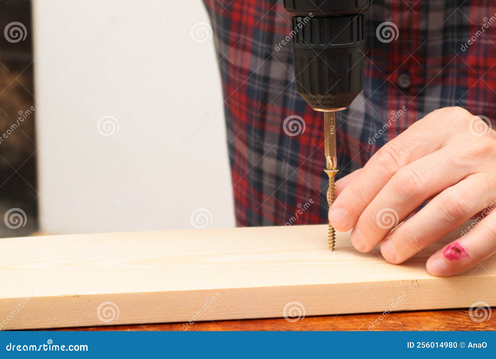 Handworker Working with an Electric Screwdriver. Carpenter Fixing ...