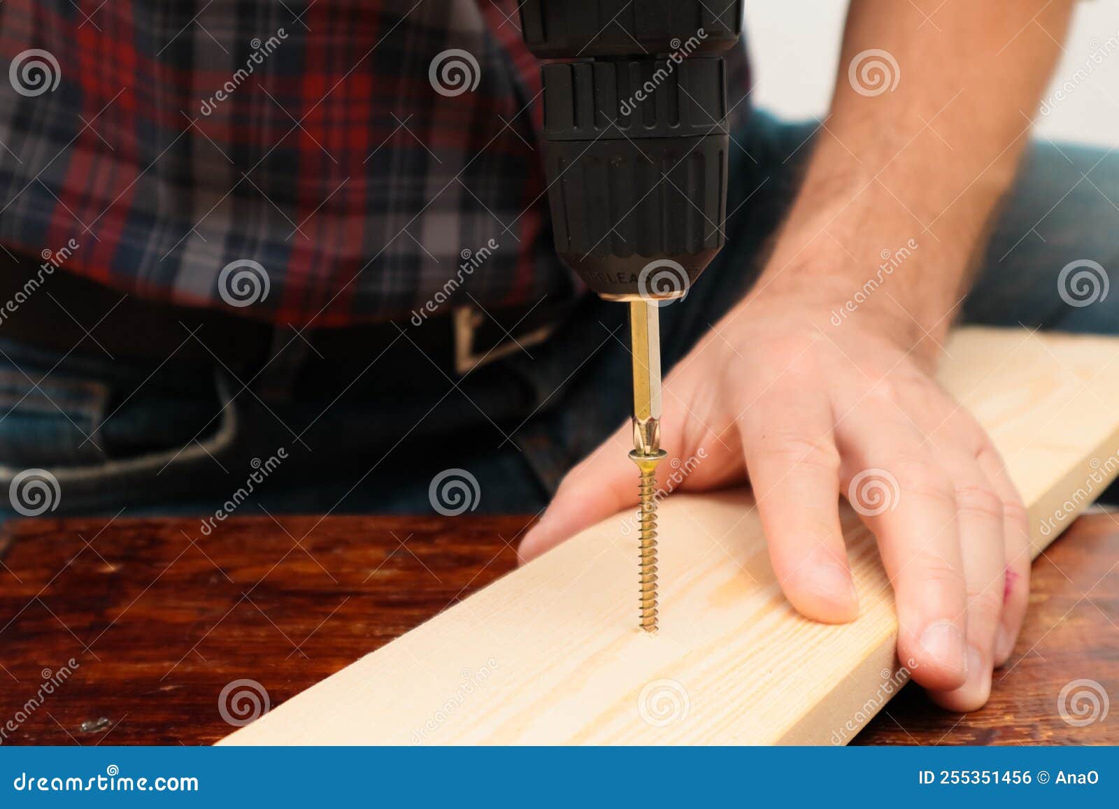 Handworker Working with an Electric Screwdriver. Carpenter Fixing ...