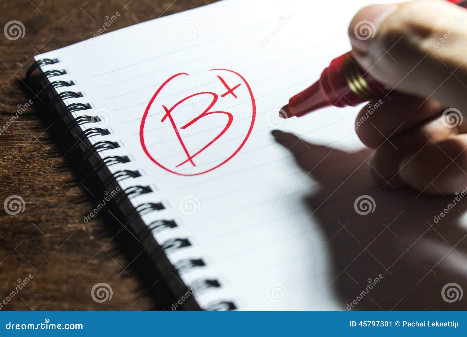 Handwriting Grade B Plus on Notebook Stock Image - Image of performance ...
