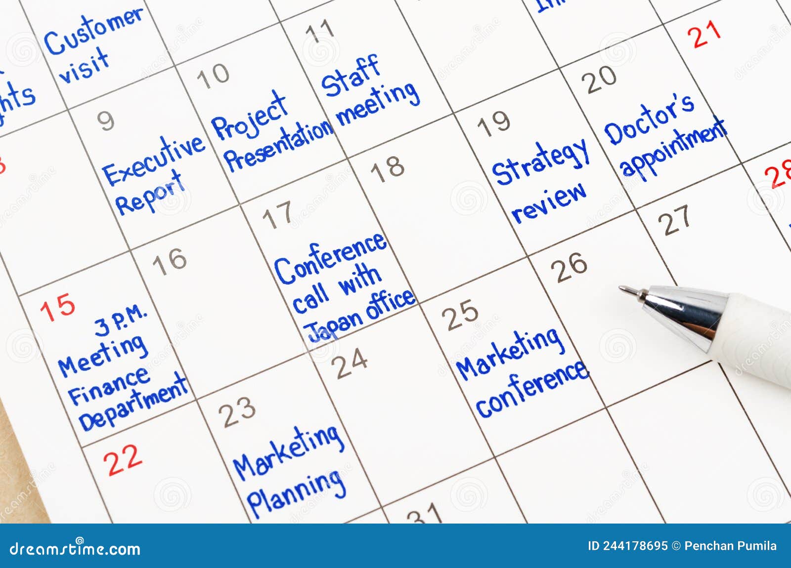 Handwriting Scheduling Appointments on Calendar Sheet with Pen Stock ...