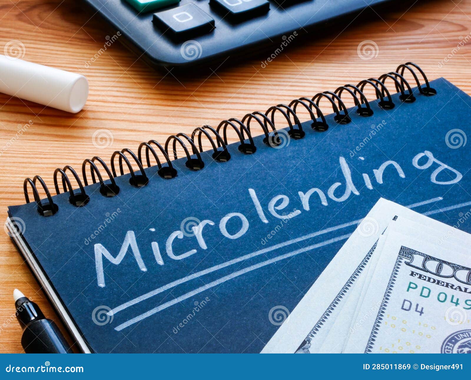 Written Word Microlending in the Notepad and Cash. Stock Image - Image ...