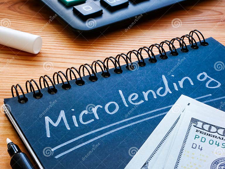 Written Word Microlending in the Notepad and Cash. Stock Image - Image ...