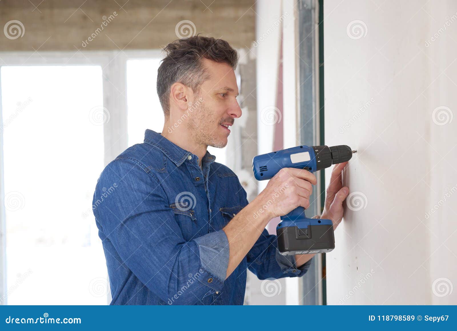 Handy Working at Construction Site Stock Image - Image of people ...