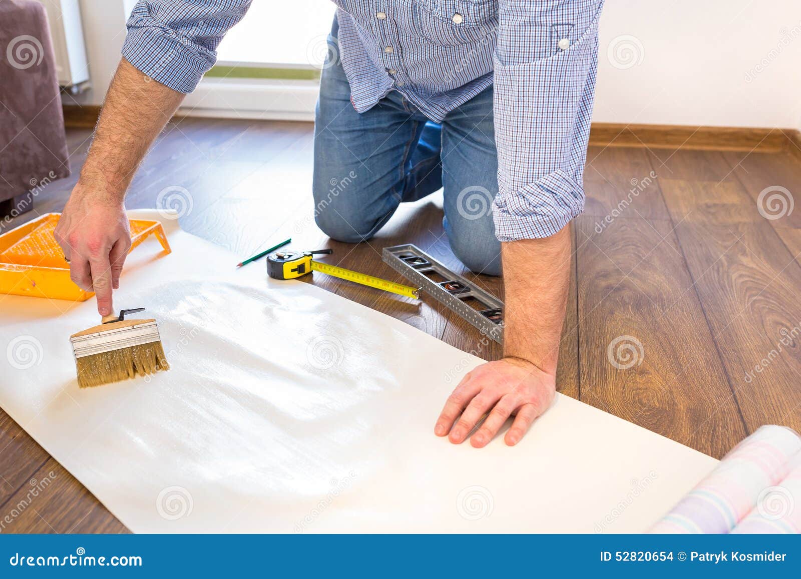 Handyman Applying Blue for a Wallpaper Stock Photo - Image of holding ...