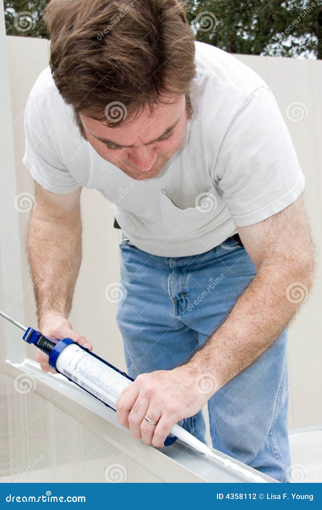 Handyman Caulking stock photo. Image of improvement, caucasian - 4358112