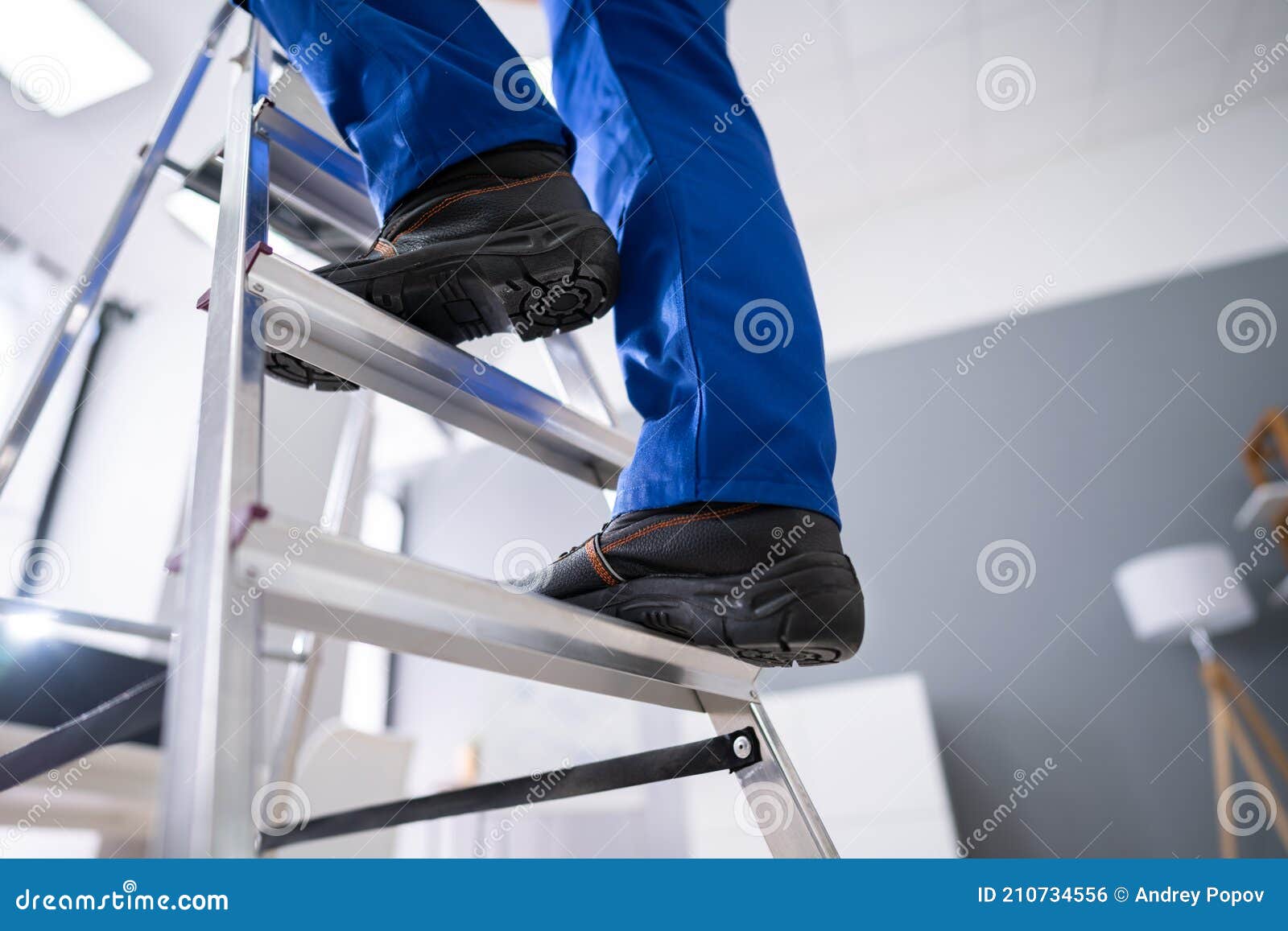 Handyman Climbing Ladder stock photo. Image of climbing - 210734556