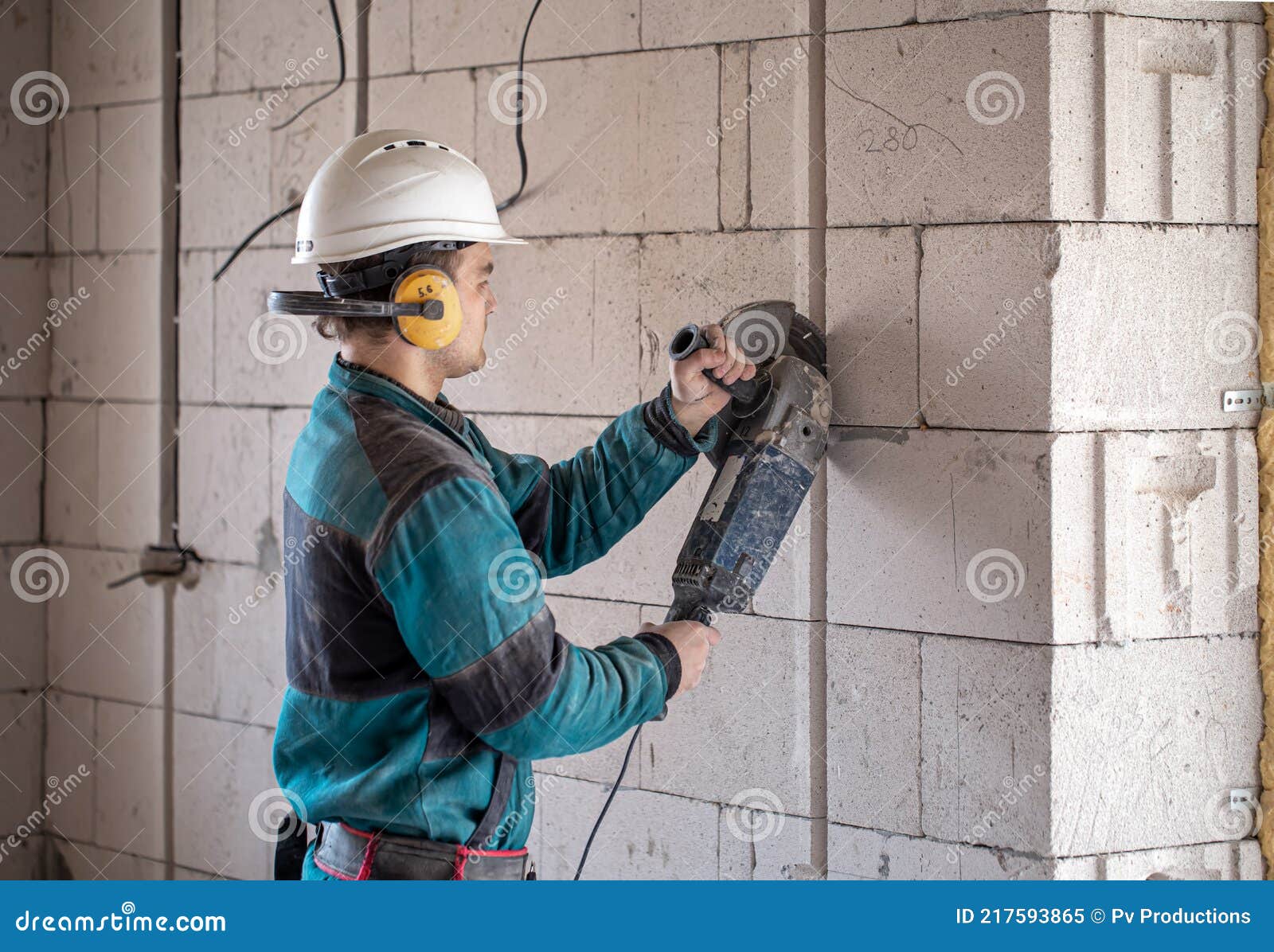 A Handyman at a Construction Site Works As a Grinder Stock Image ...