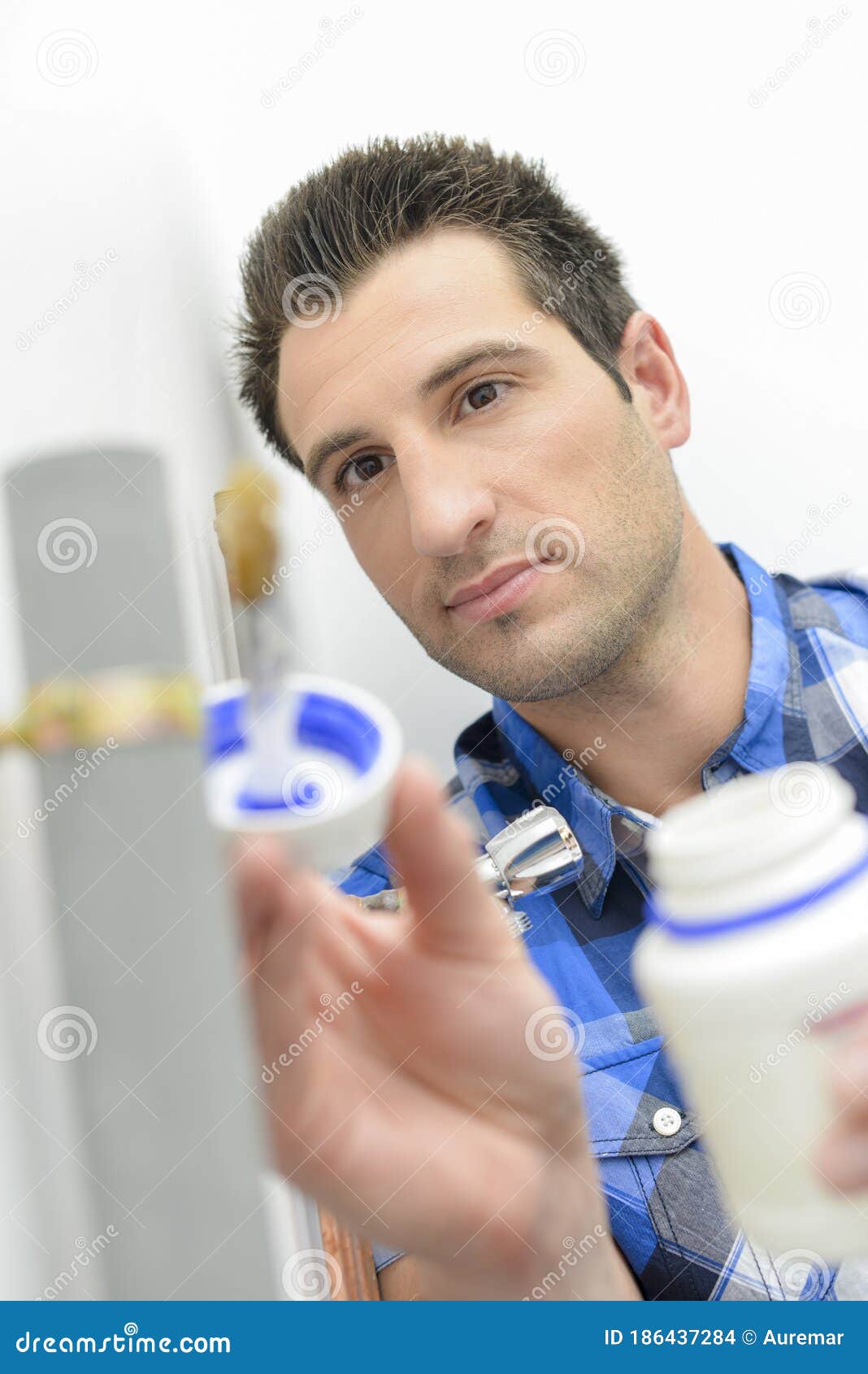 Handyman doing work stock photo. Image of house, site - 186437284