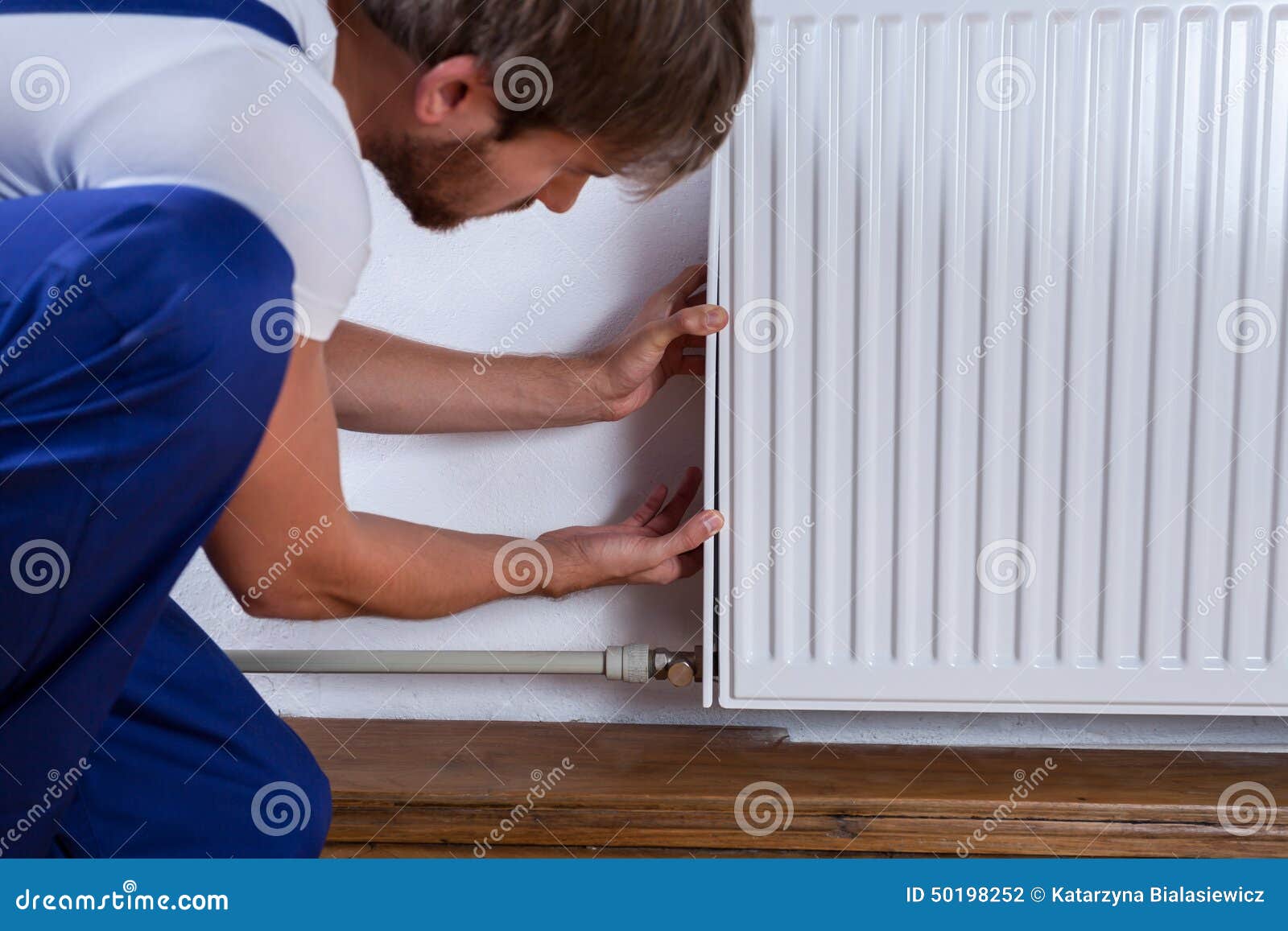 Handyman fix the radiator stock photo. Image of plumbing - 50198252