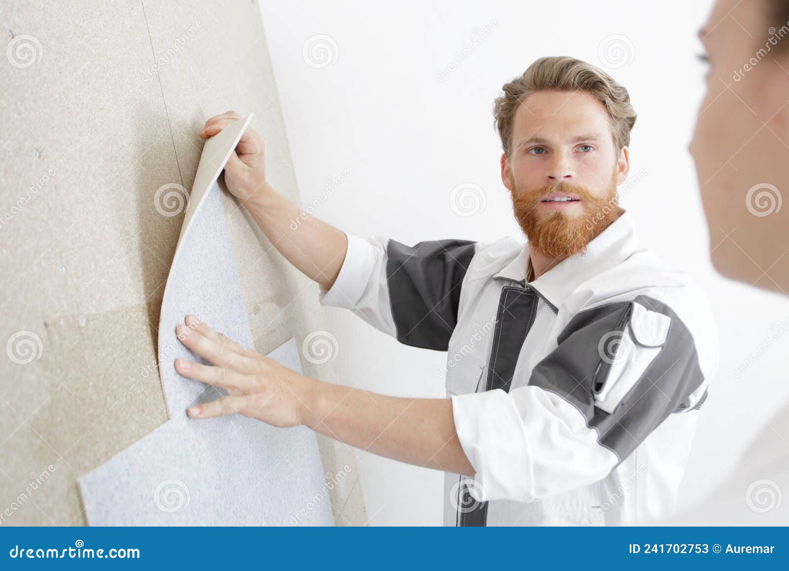 Handyman fixing wallpaper stock image. Image of brush - 241702753