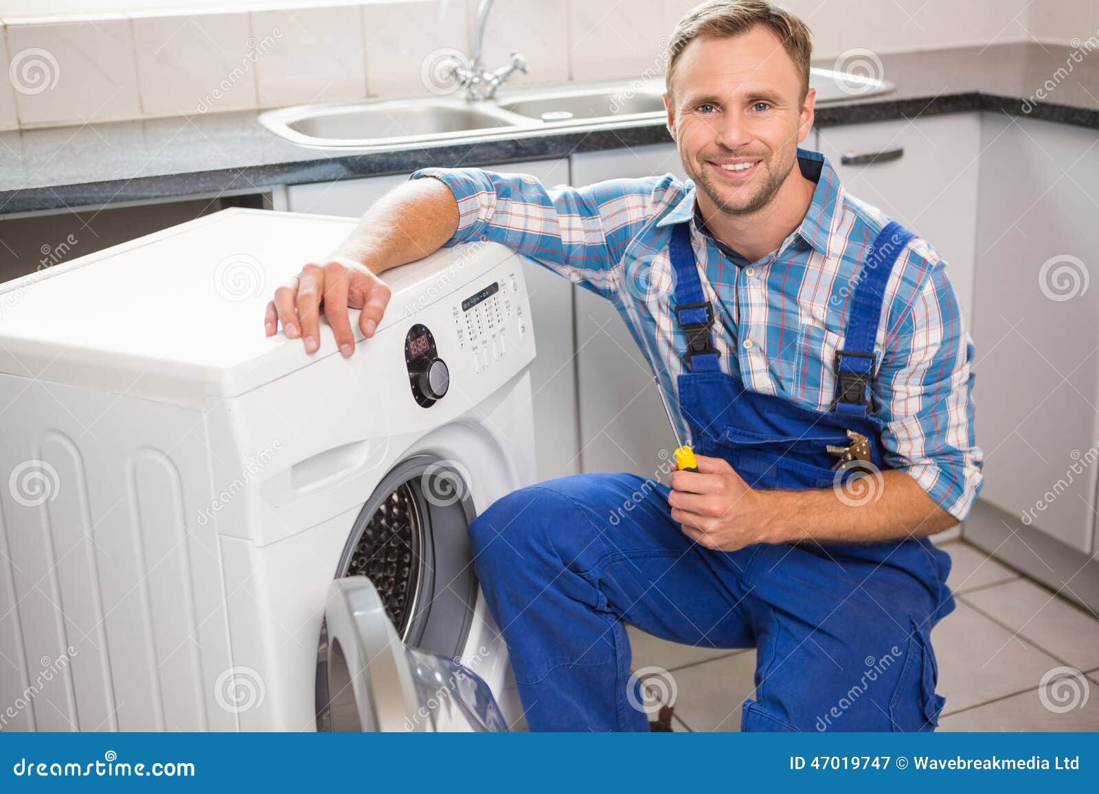 Handyman Fixing a Washing Machine Stock Image - Image of repairman ...