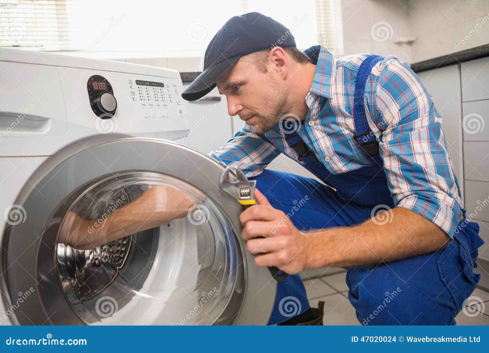 Handyman Fixing a Washing Machine Stock Photo - Image of repairman ...