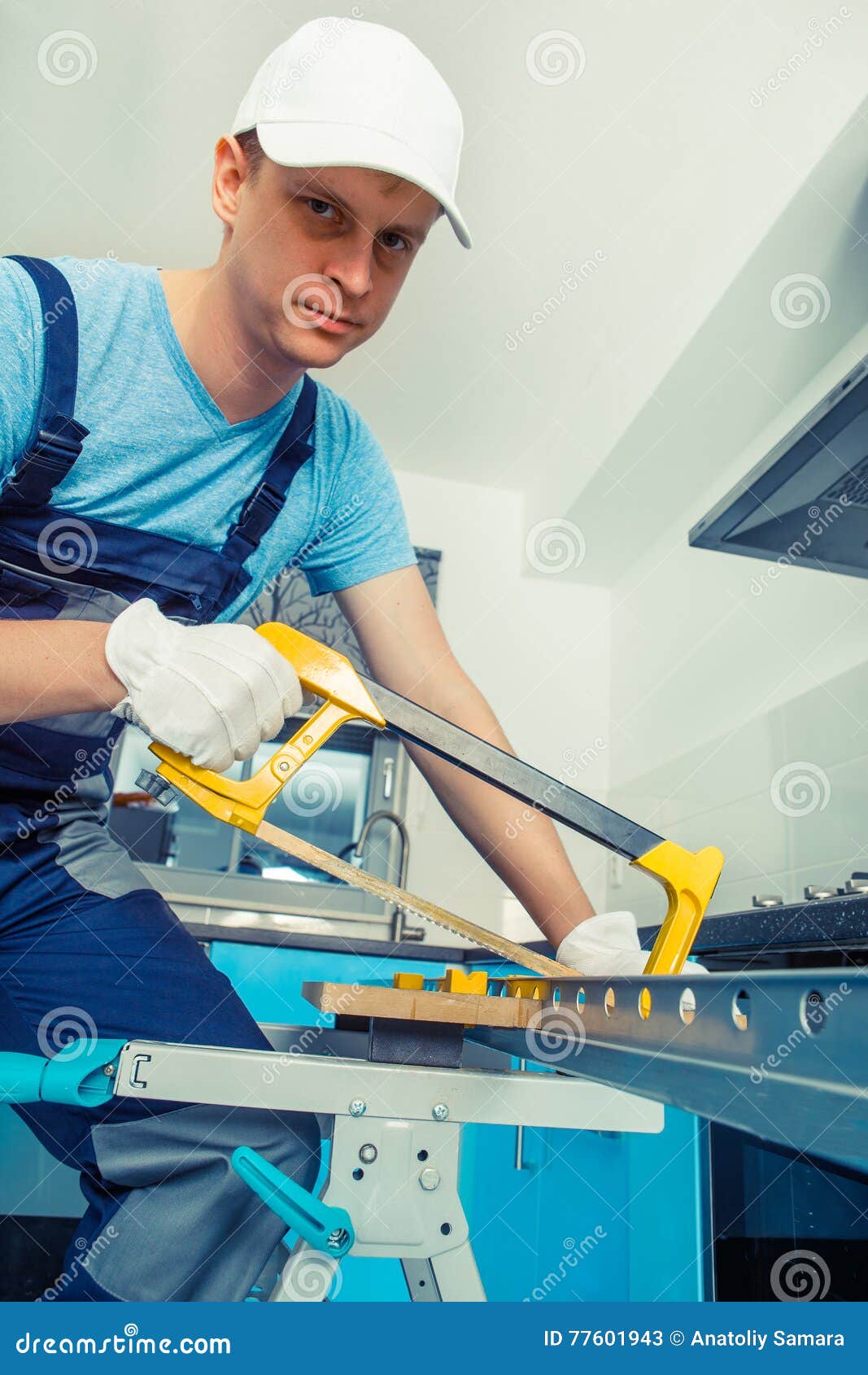 Handyman with a hacksaw stock image. Image of builder - 77601943
