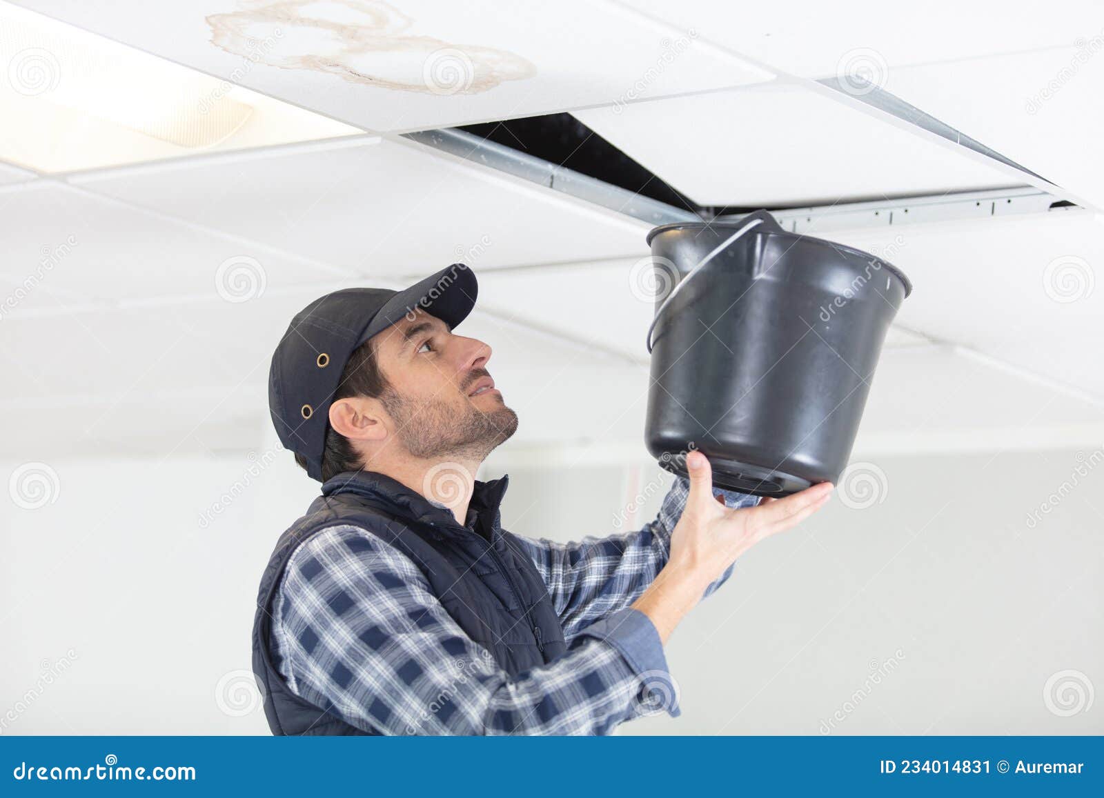 Handyman Holds Bucket Under Ceiling Panel Stock Image - Image of hold ...