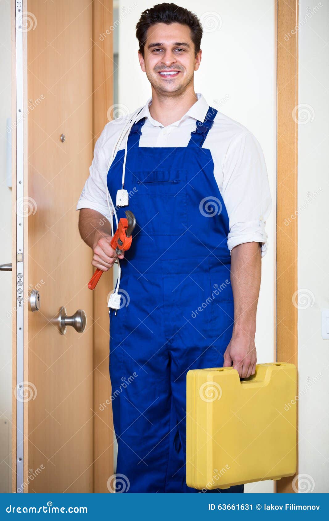 Handyman at house entrance stock image. Image of male - 63661631
