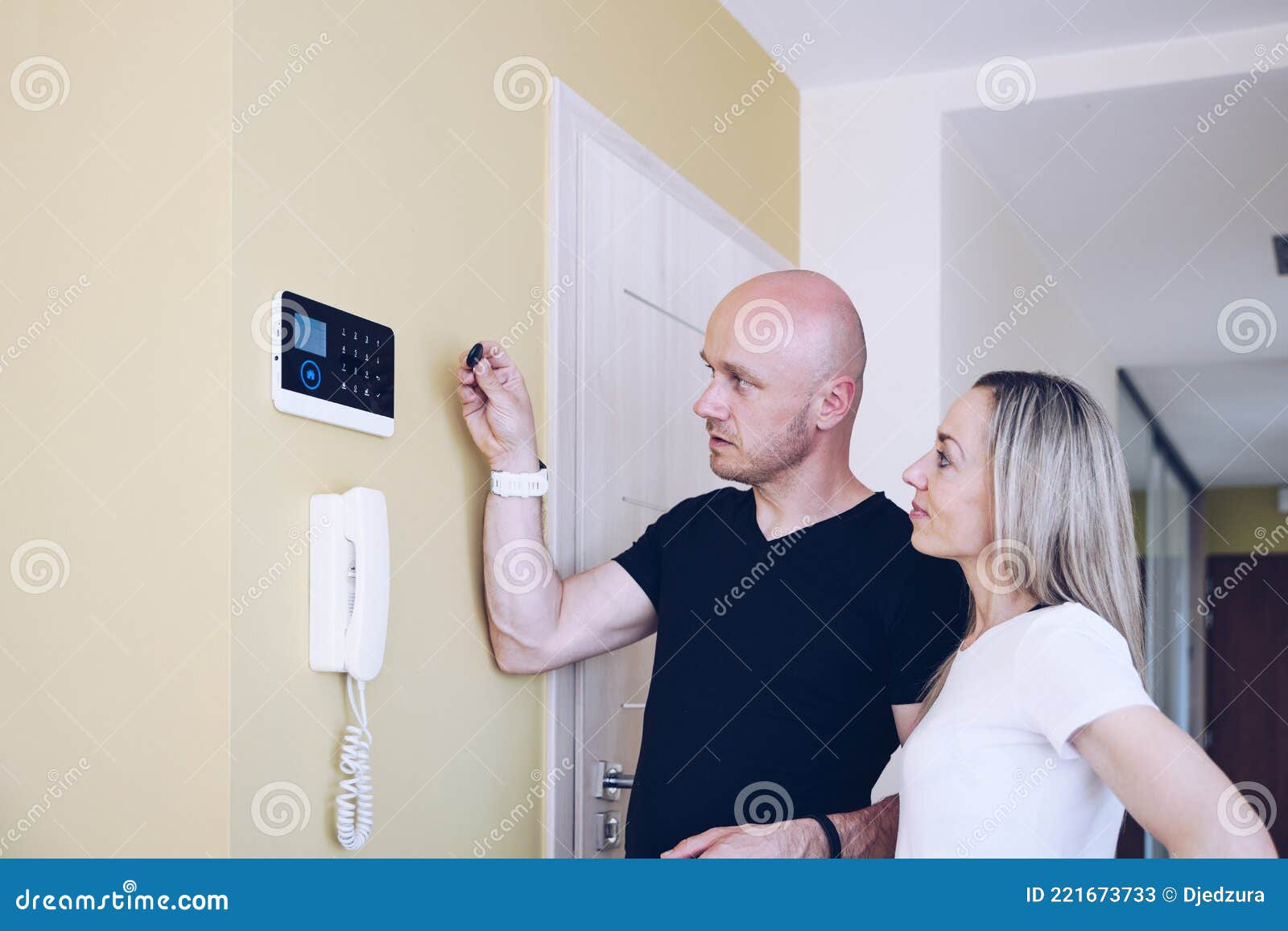Handyman Installing Security System. the Woman is Learning How To ...