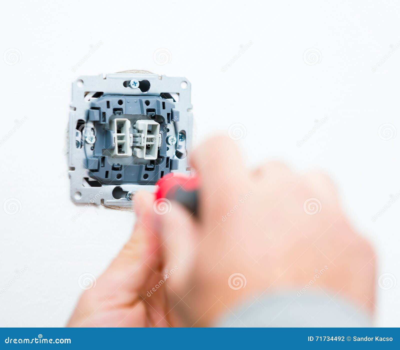 Handyman Installing Socket stock photo. Image of electrician - 71734492