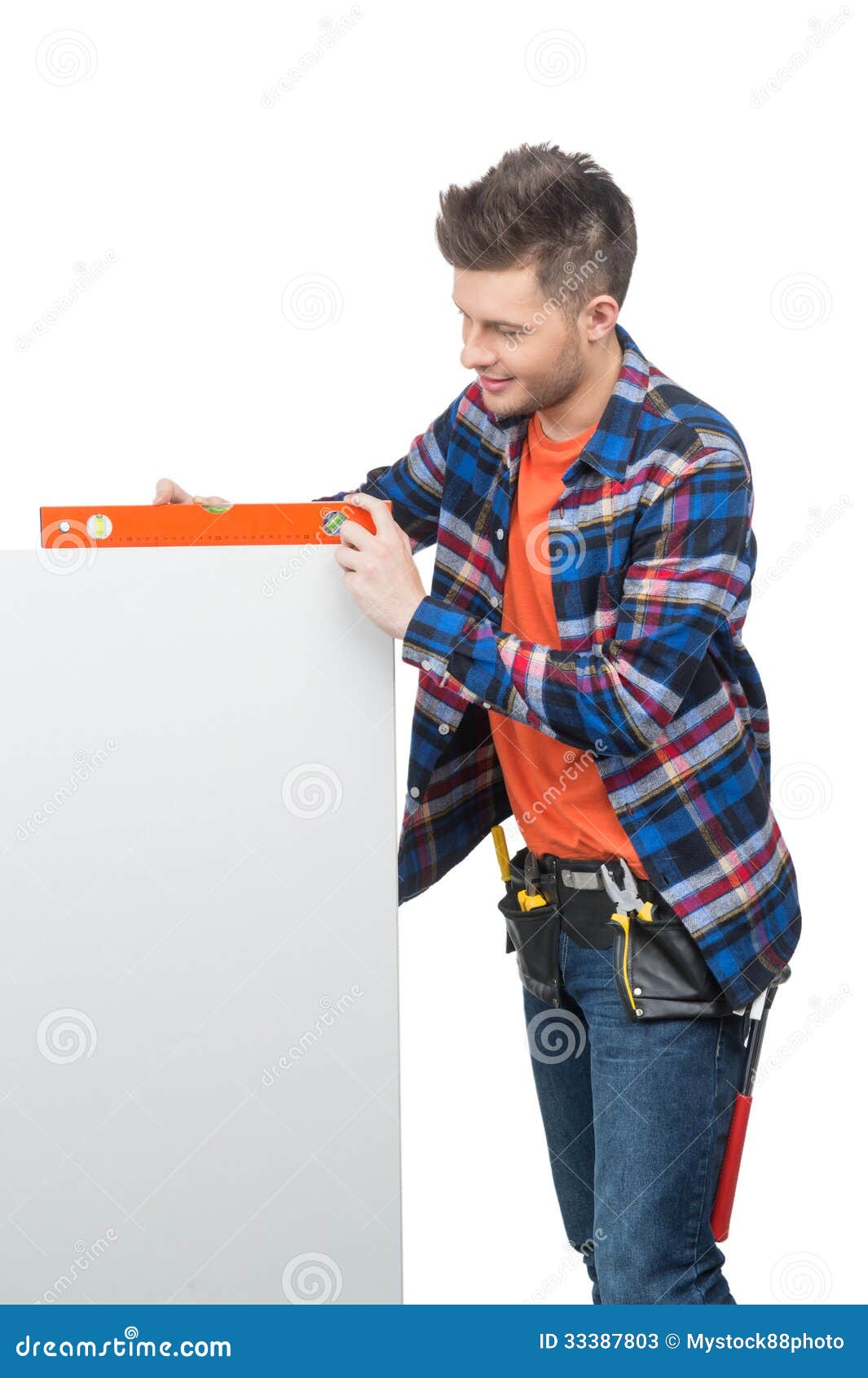 Handyman measuring level. stock image. Image of occupation - 33387803