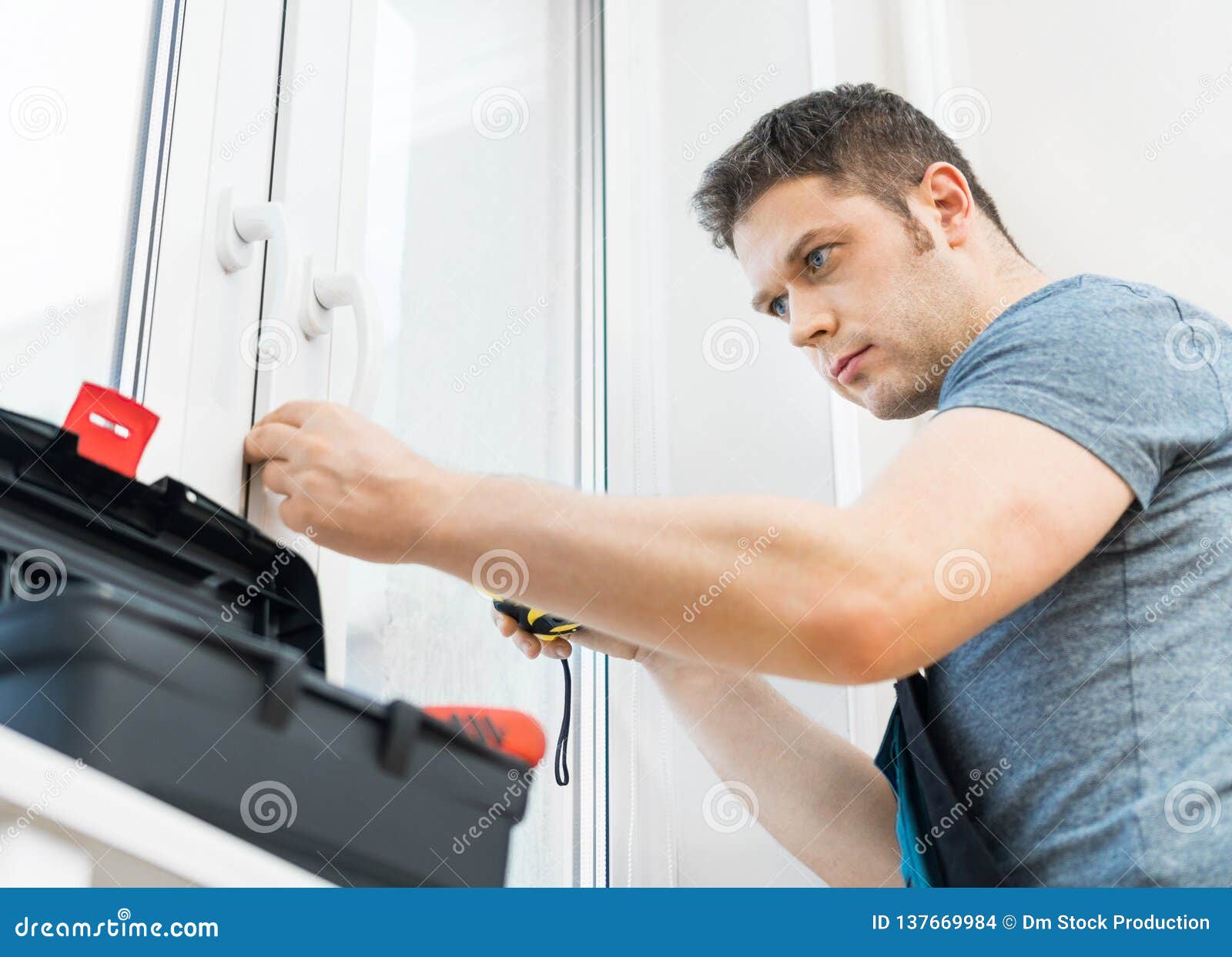 Handyman measuring window stock photo. Image of hands - 137669984