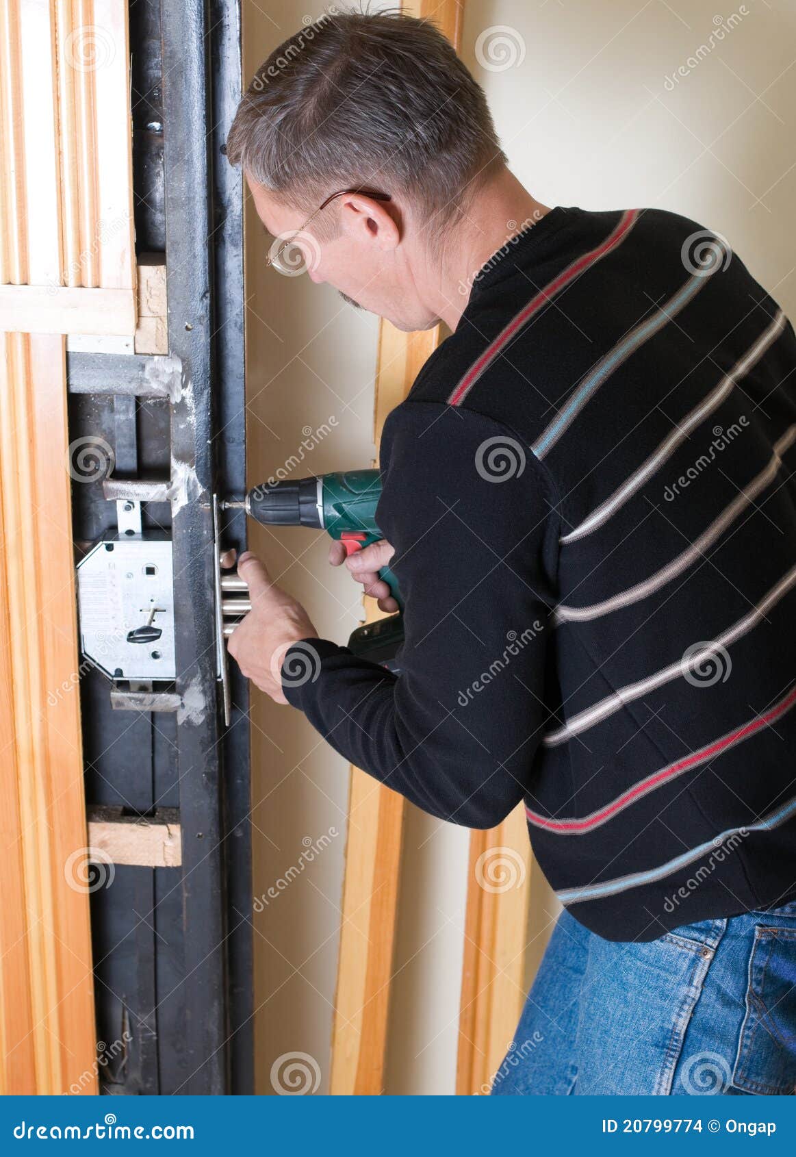 Handyman repairing lock stock photo. Image of protection - 20799774