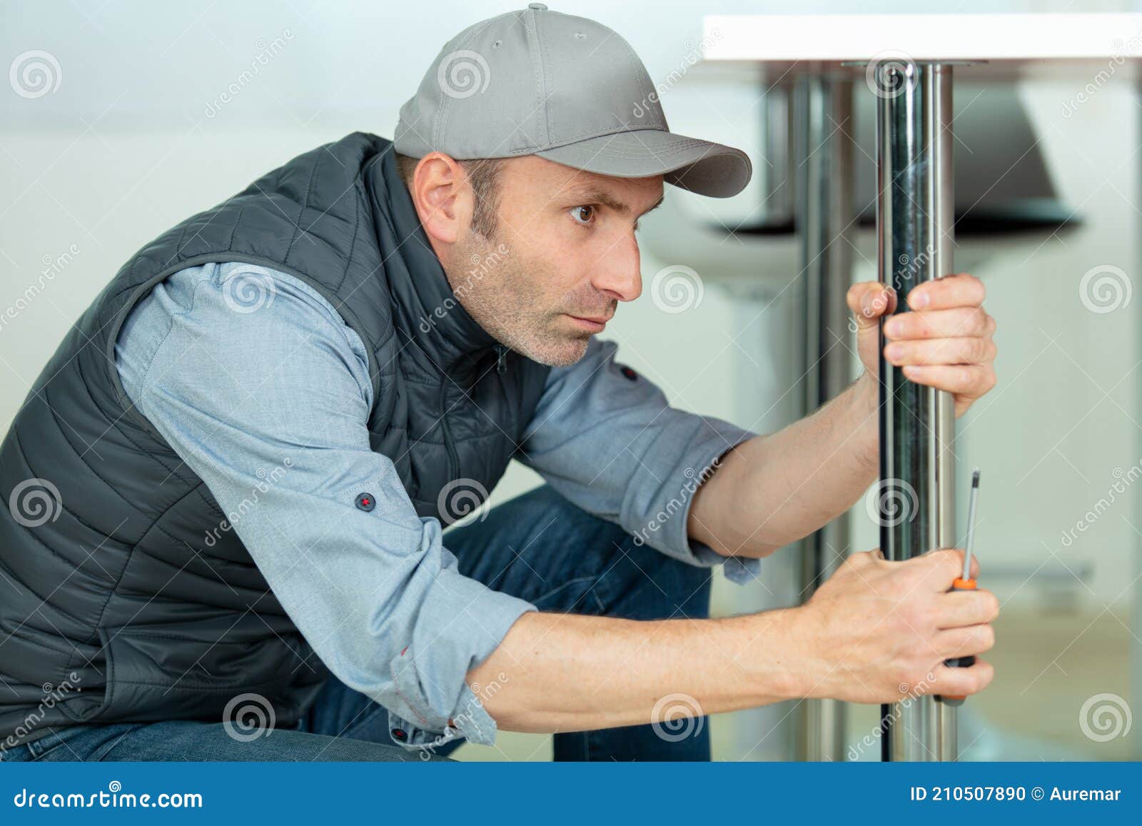 Handyman Secures Supporting Bar Under Worktop Stock Photo - Image of ...