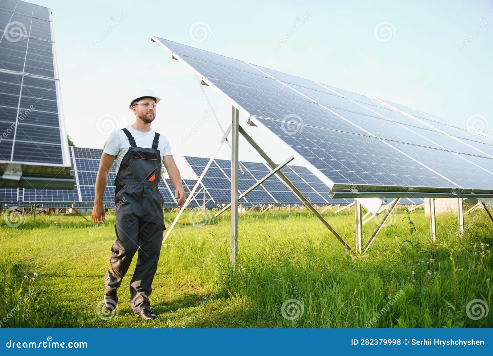 A Handyman Standing with Solar Panels. Stock Photo - Image of ...